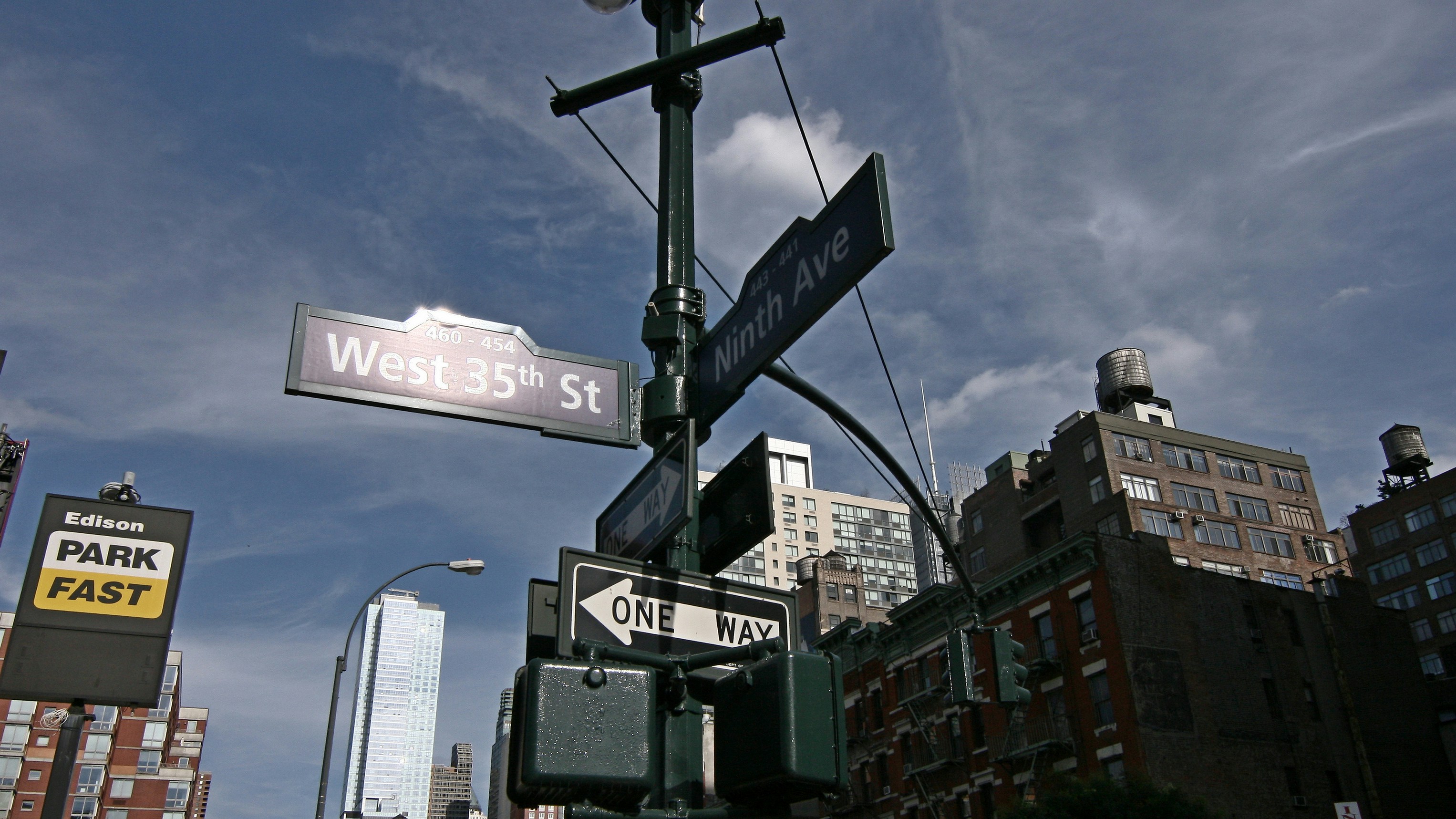 A street light with street signs on it photo – Free Ninth ave Image on ...