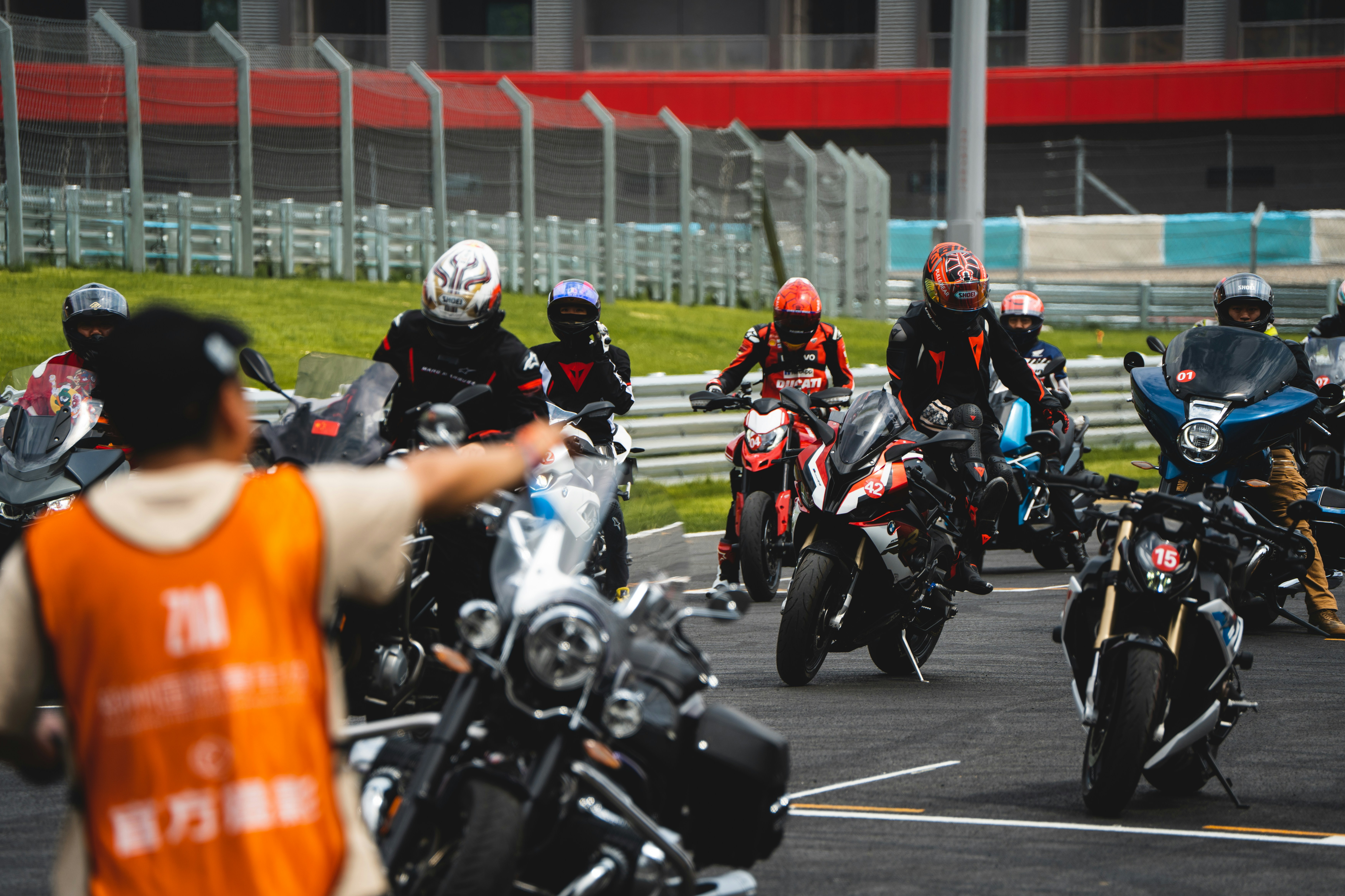 A group of people riding motorcycles down a street photo – Free Bmw ...