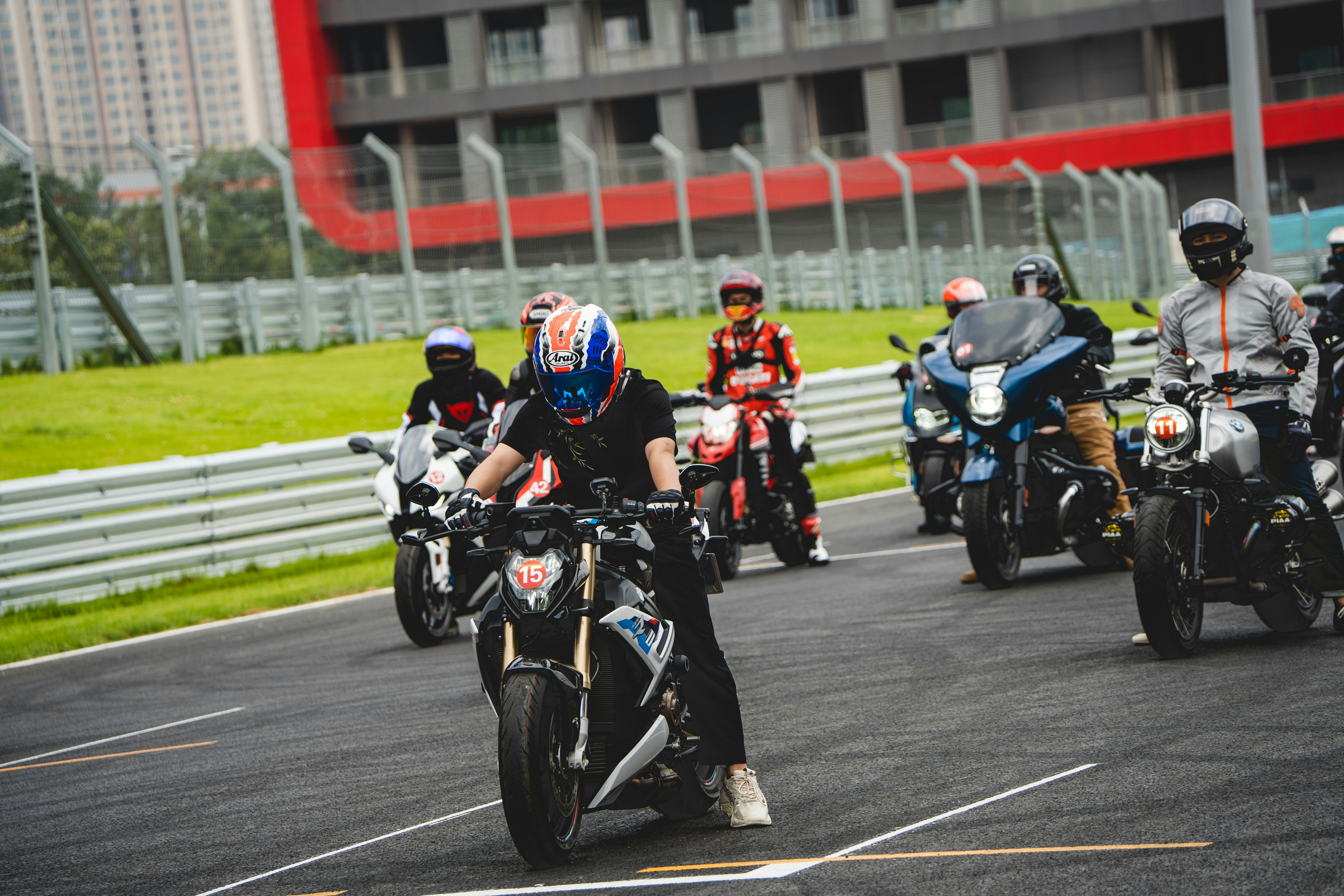 A group of people riding motorcycles down a street photo – Free Bmw ...