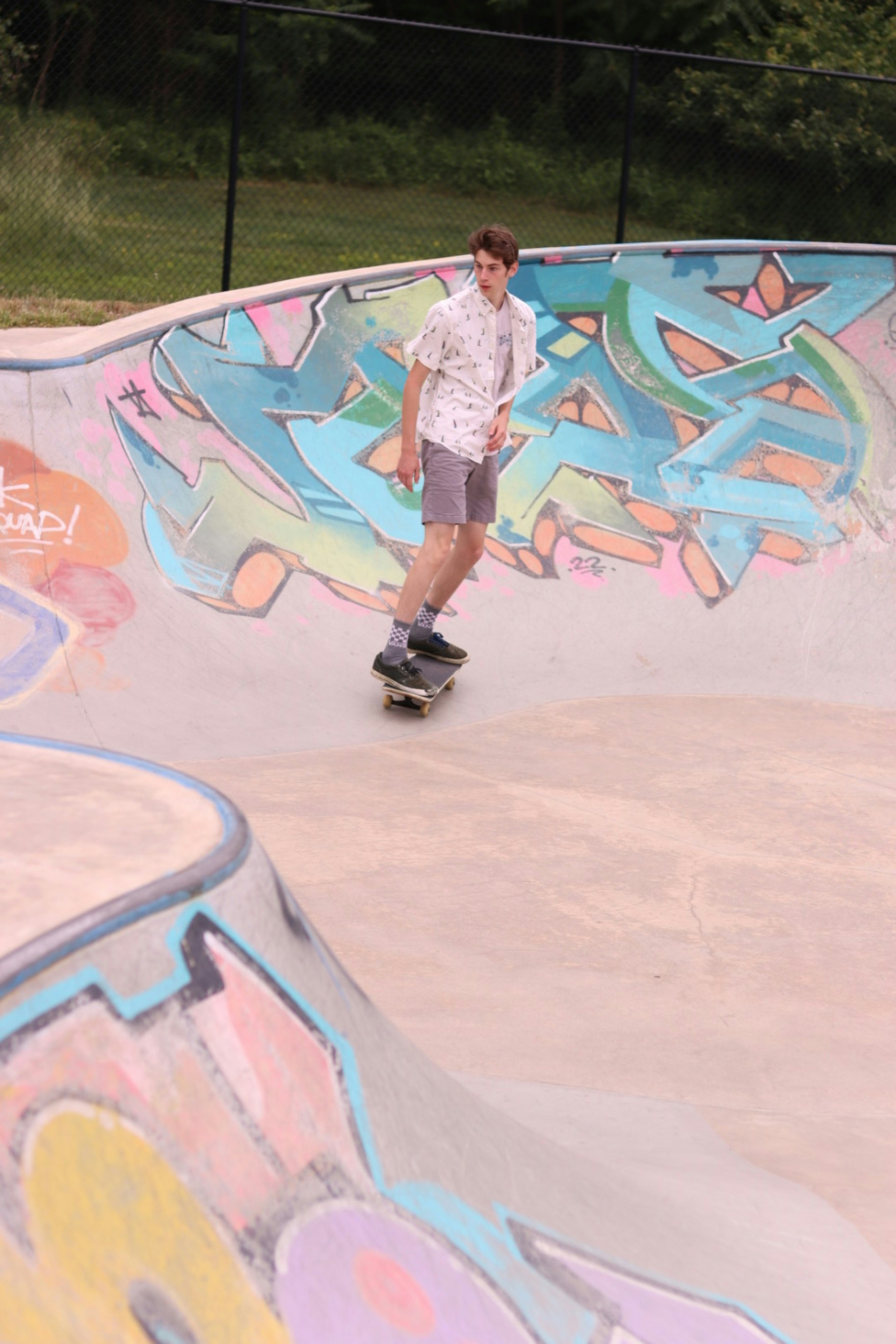 Concrete Rhythm: A Teen Skater Carves Through a Graffiti Bowl