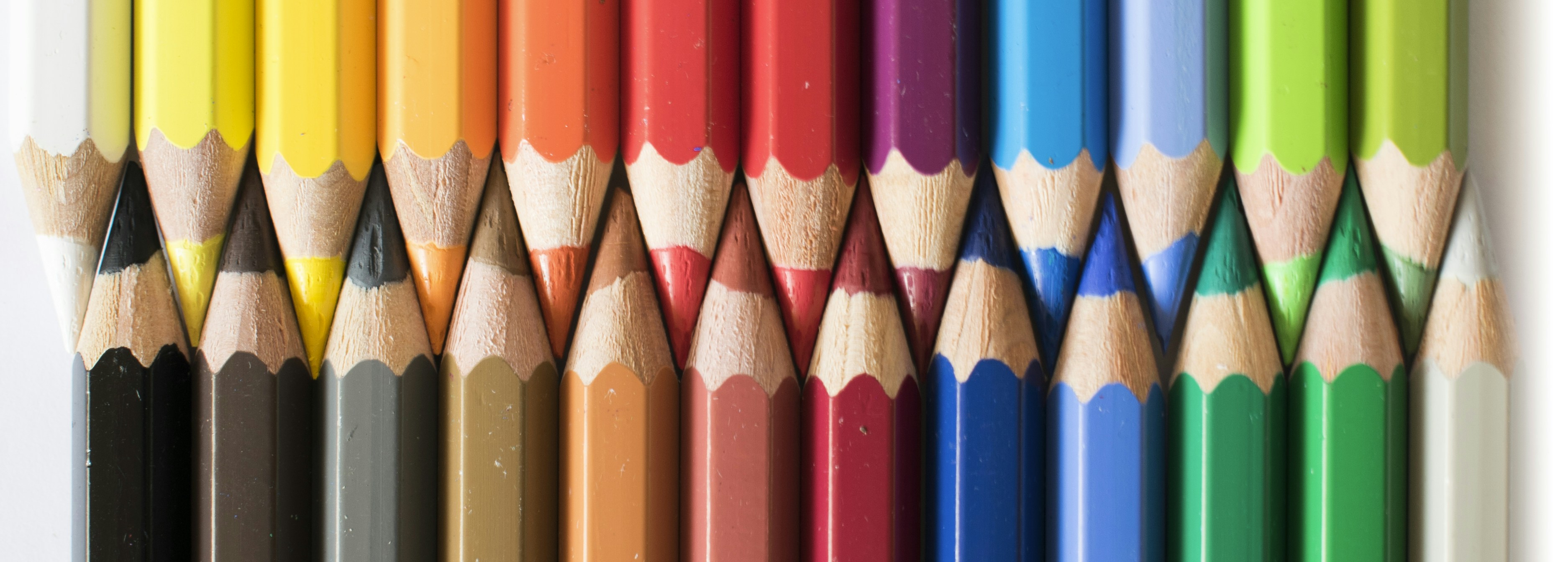 A group of colored pencils lined up in a row photo – Free Pencils Image ...
