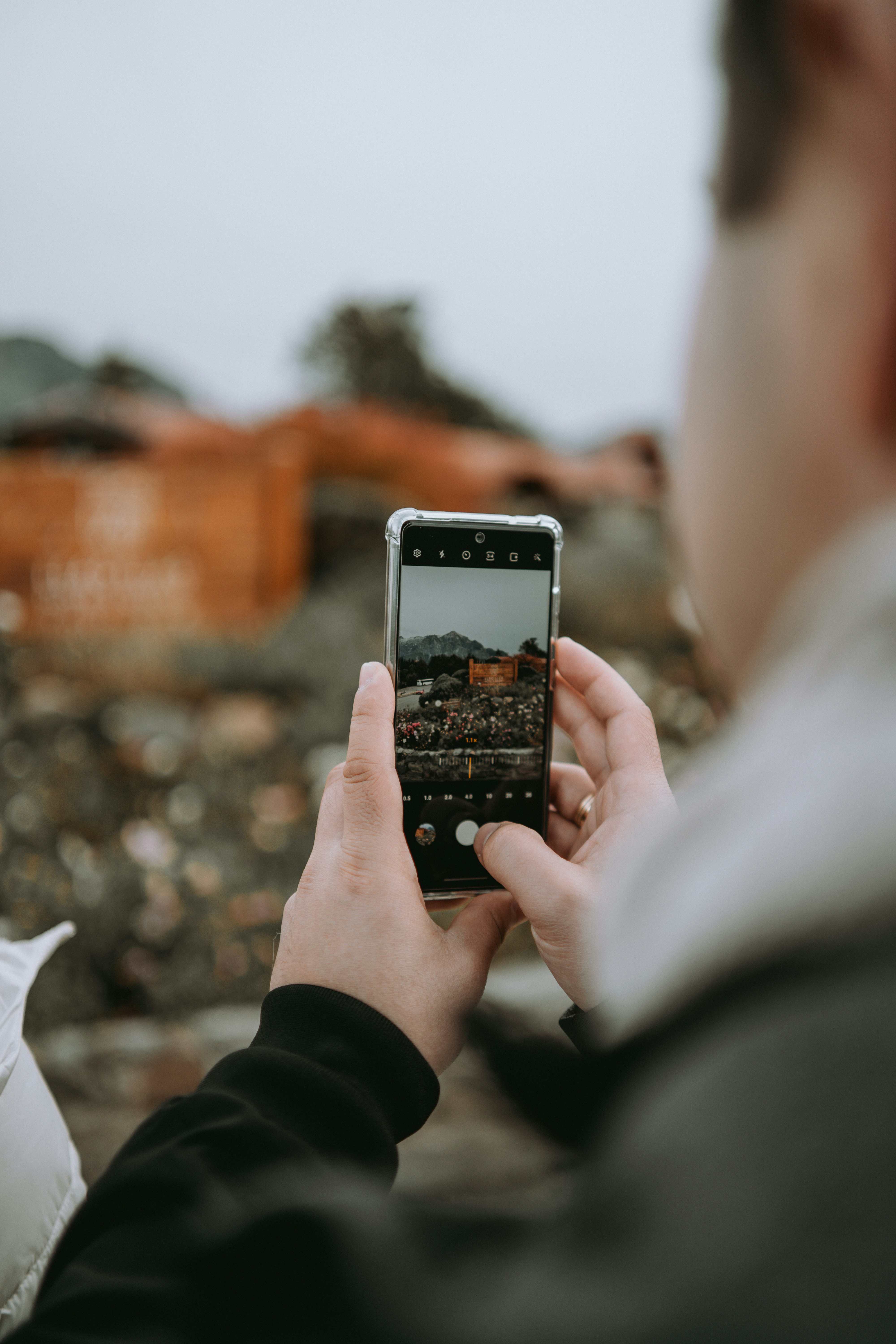 A Quiet Moment Captured: Hands and Smartphone Framing a Scene