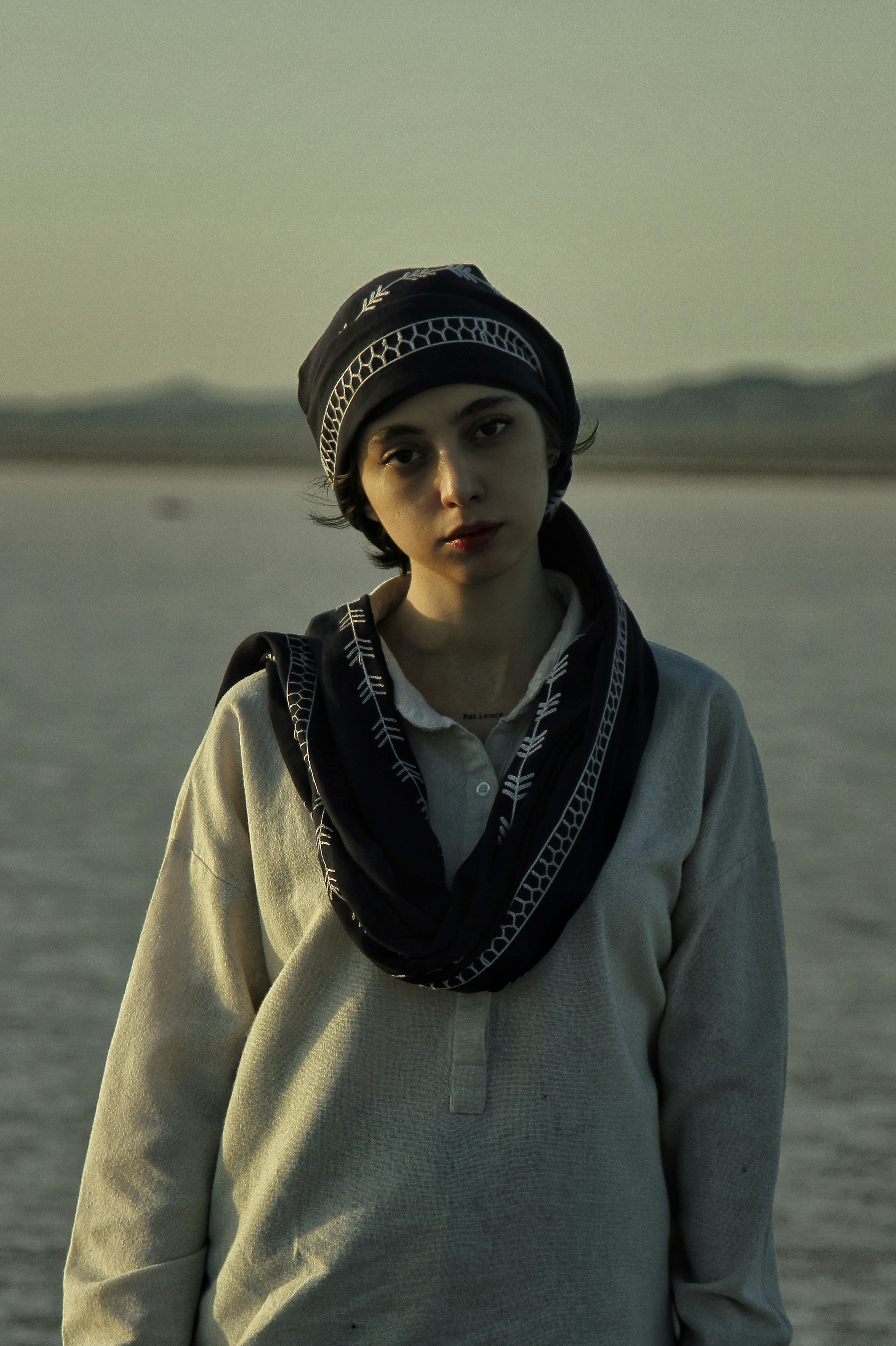Dusk Portrait by Quiet Sea: A Woman in a Patterned Scarf