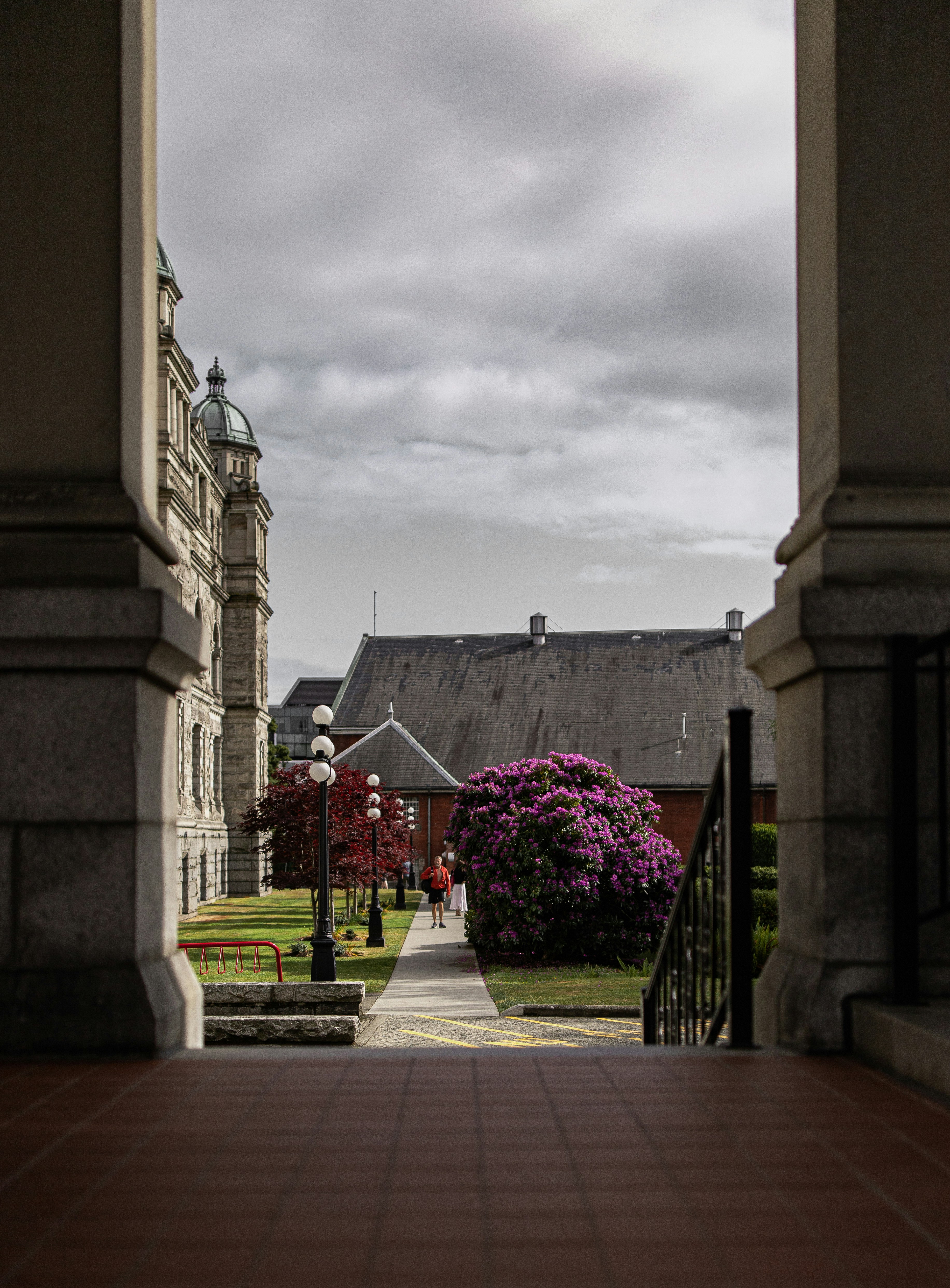 Framed Archway, Blooming Path: A Quiet Campus Moment