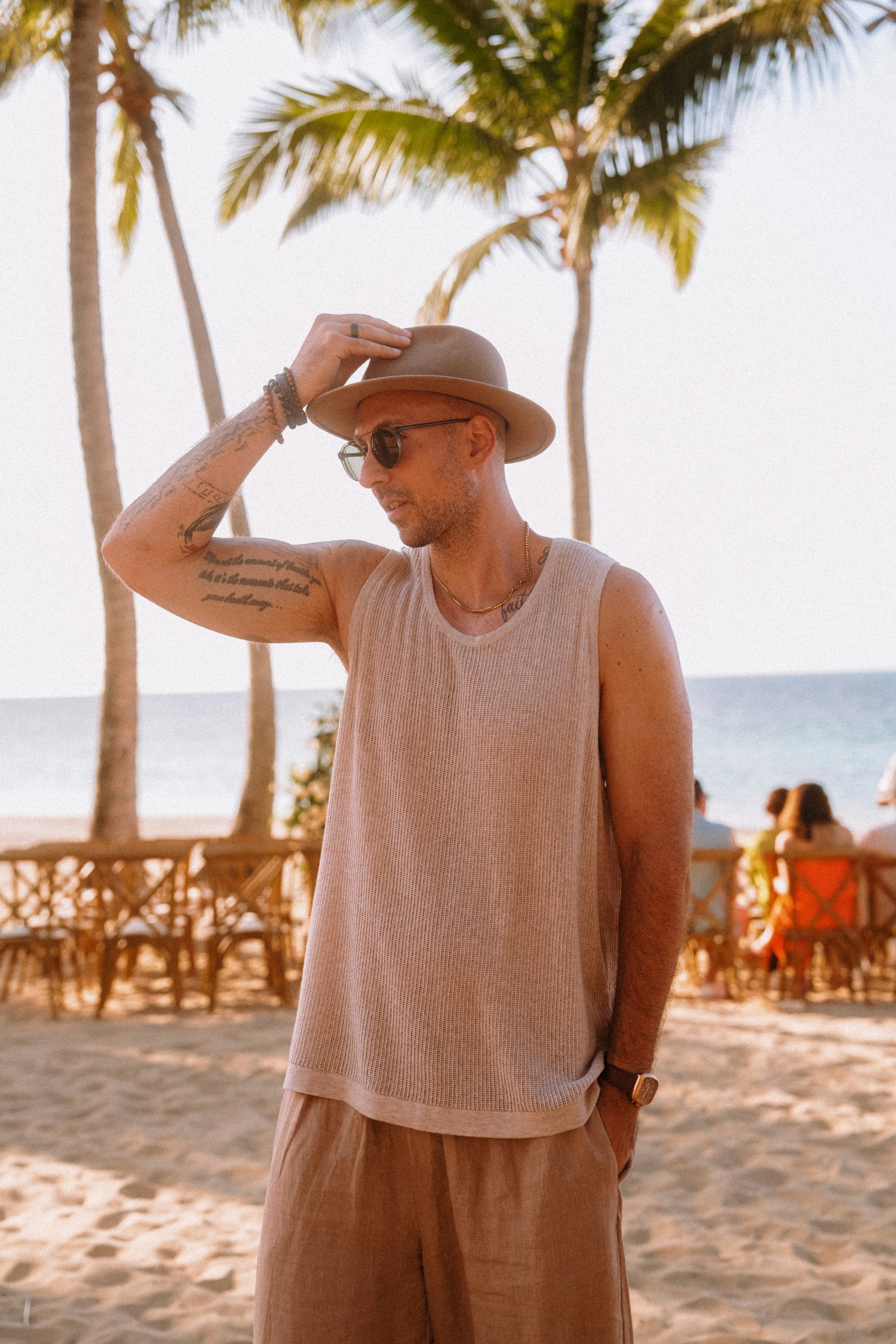 Beige Light on the Beach: A Quiet Portrait Under Palm Arches