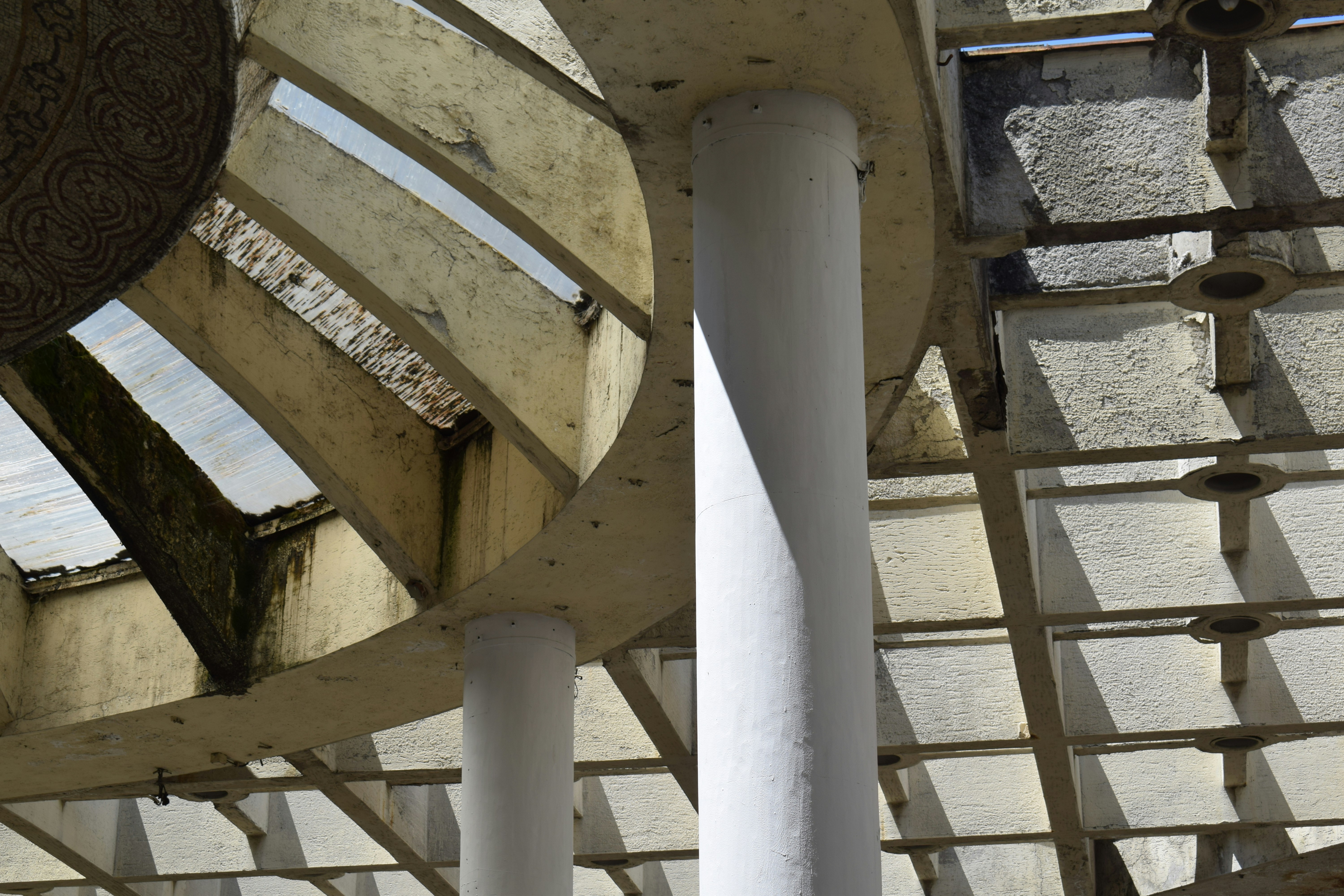 A close up of a building with columns and a skylight photo – Free ...