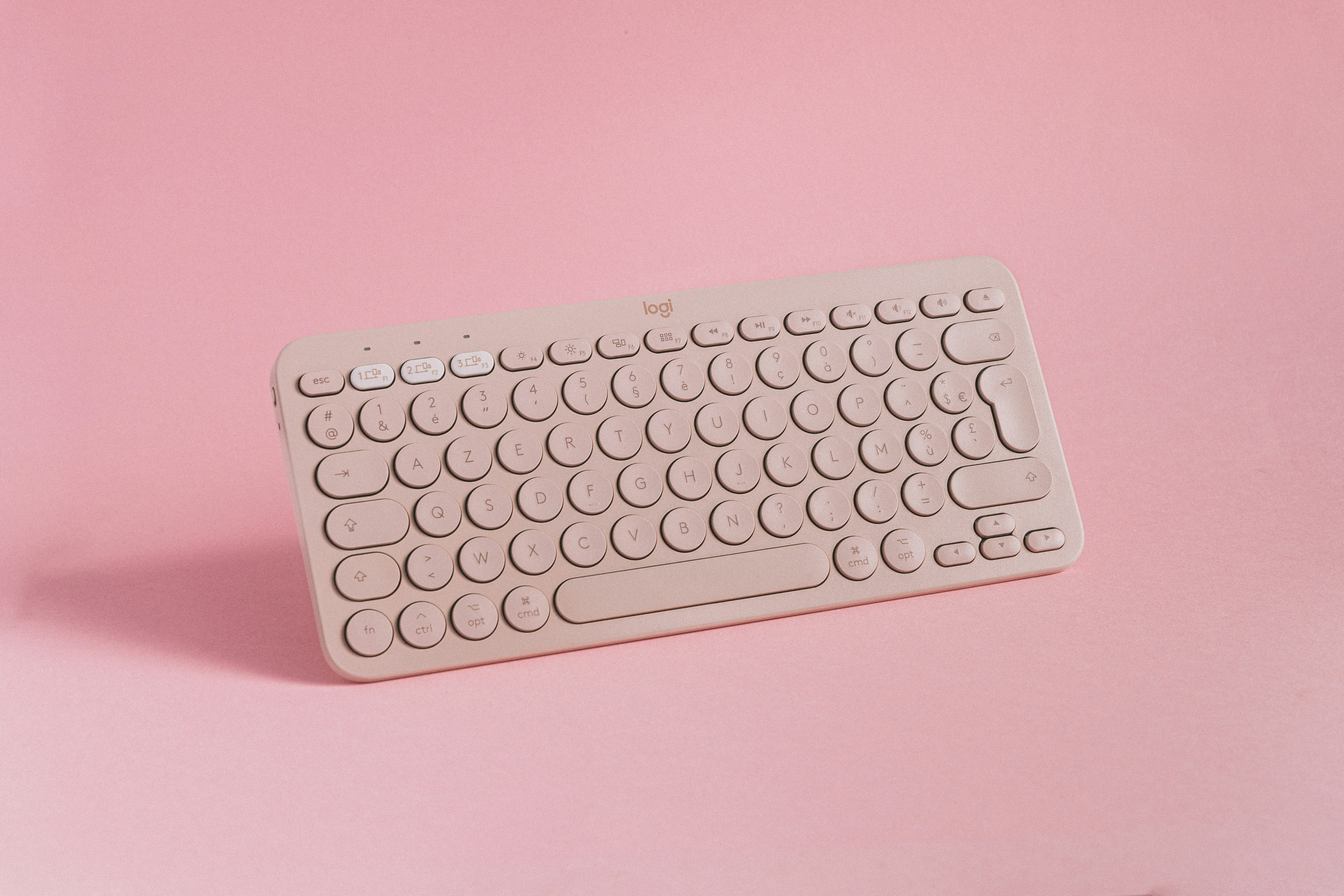 A computer keyboard on a pink background photo – Free Electronic Image ...