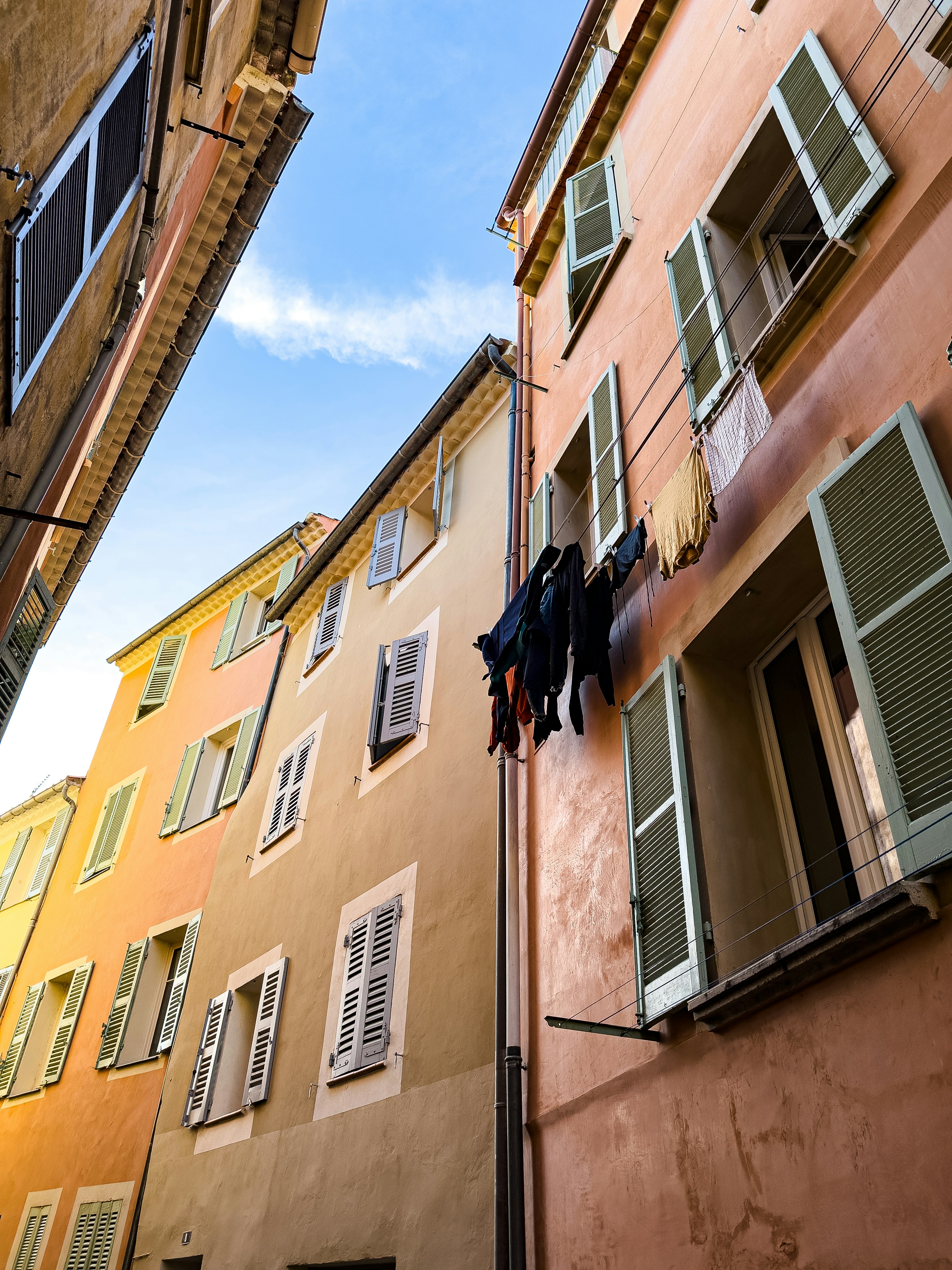 A couple of people hanging out of a window photo – Free France Image on ...