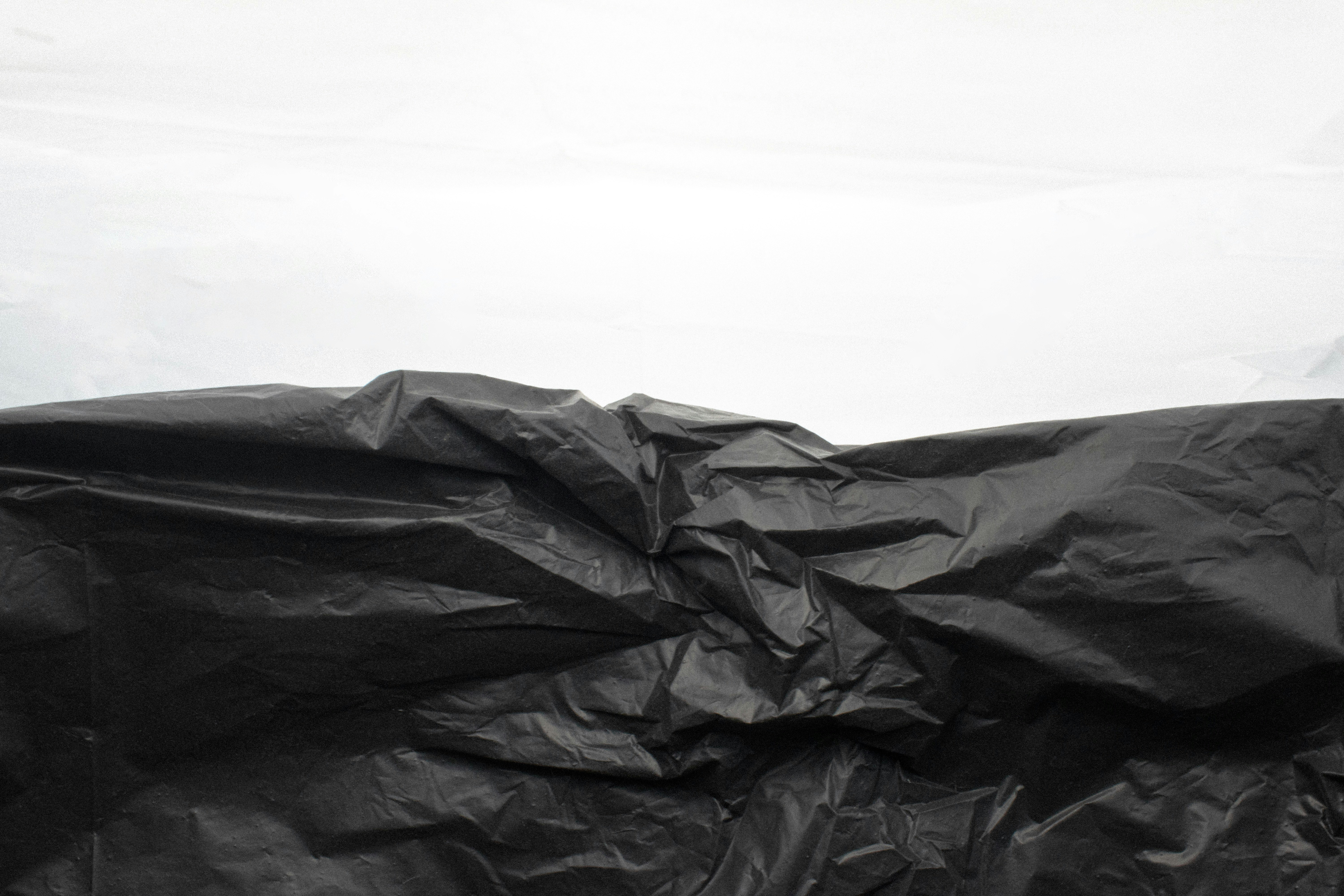 A large black piece of plastic sitting on top of a table photo – Free ...