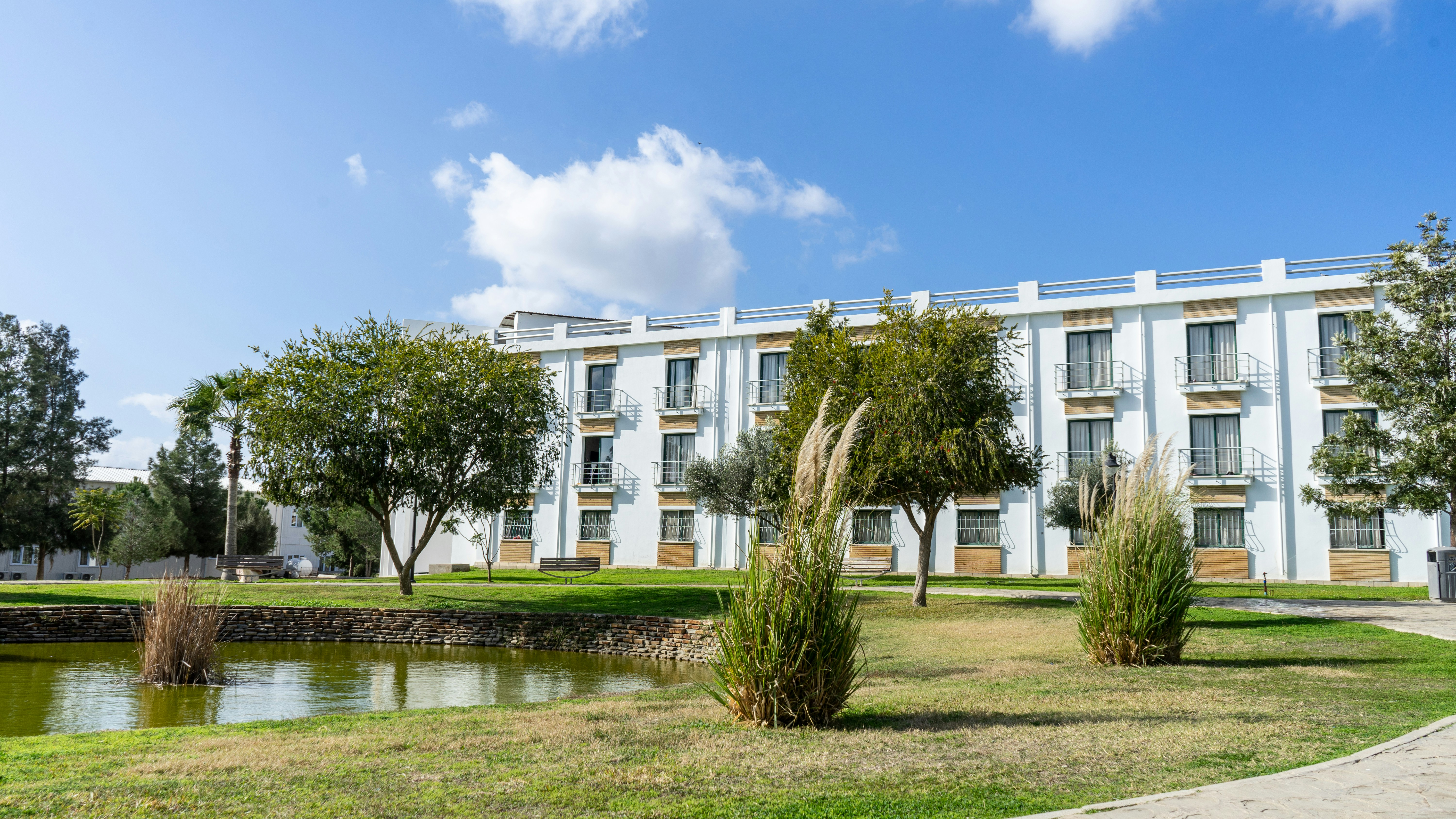 A building with a pond in front of it photo – Free North cyprus Image ...