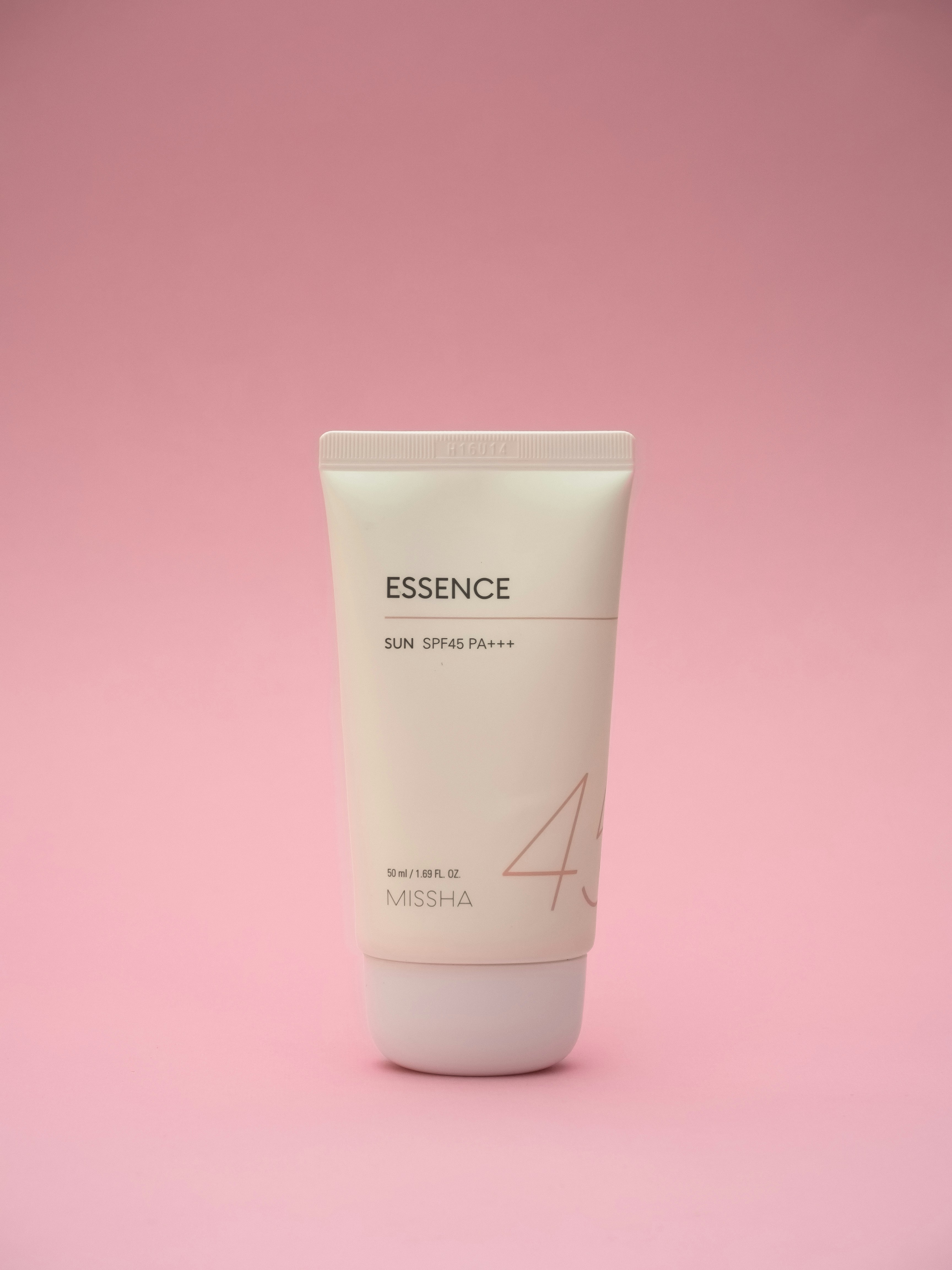 A tube of cream on a pink background photo – Free Product Image on Unsplash