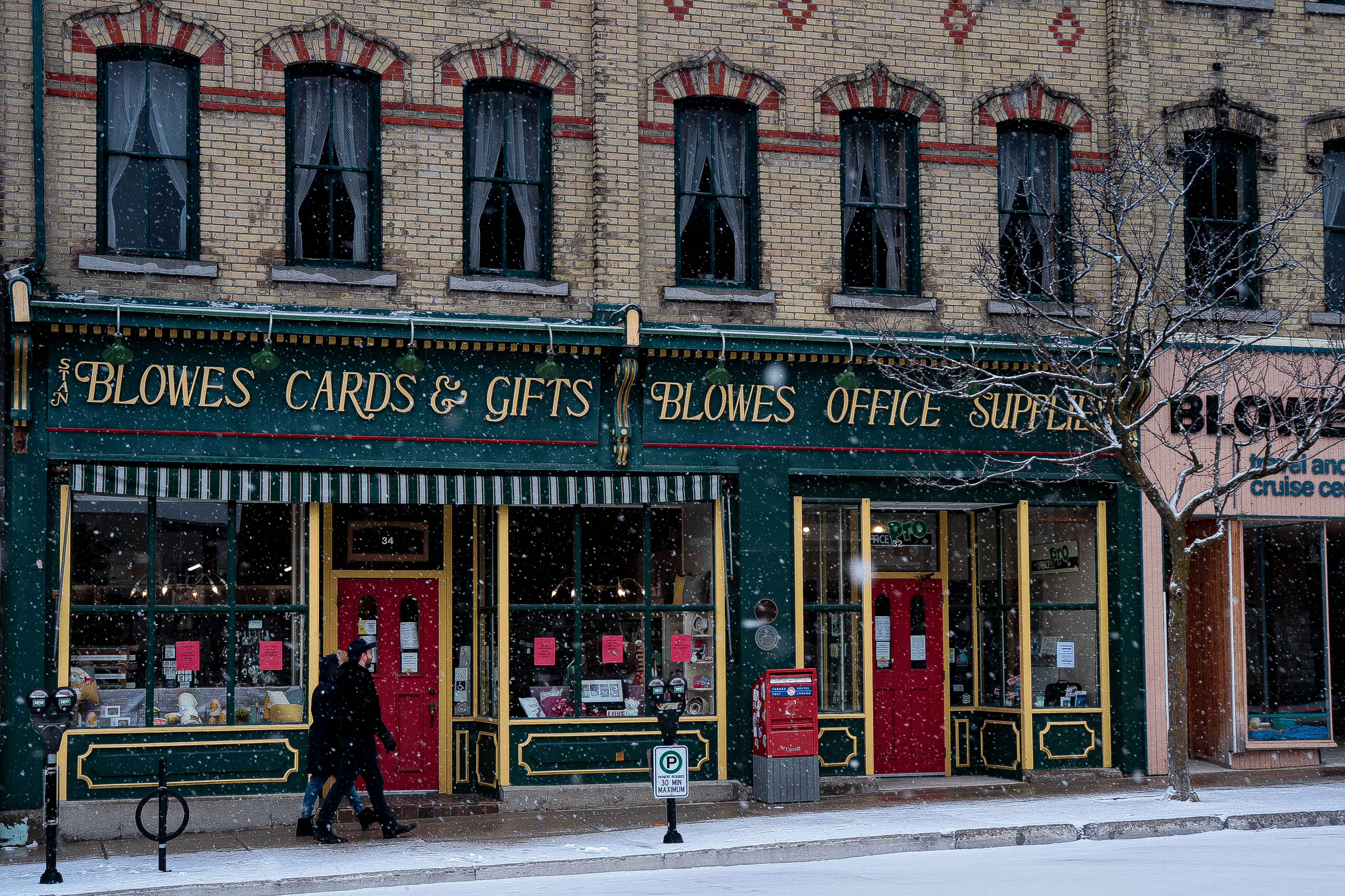 Snowy Facade: A Victorian Gift Shop Framed by Falling Snow
