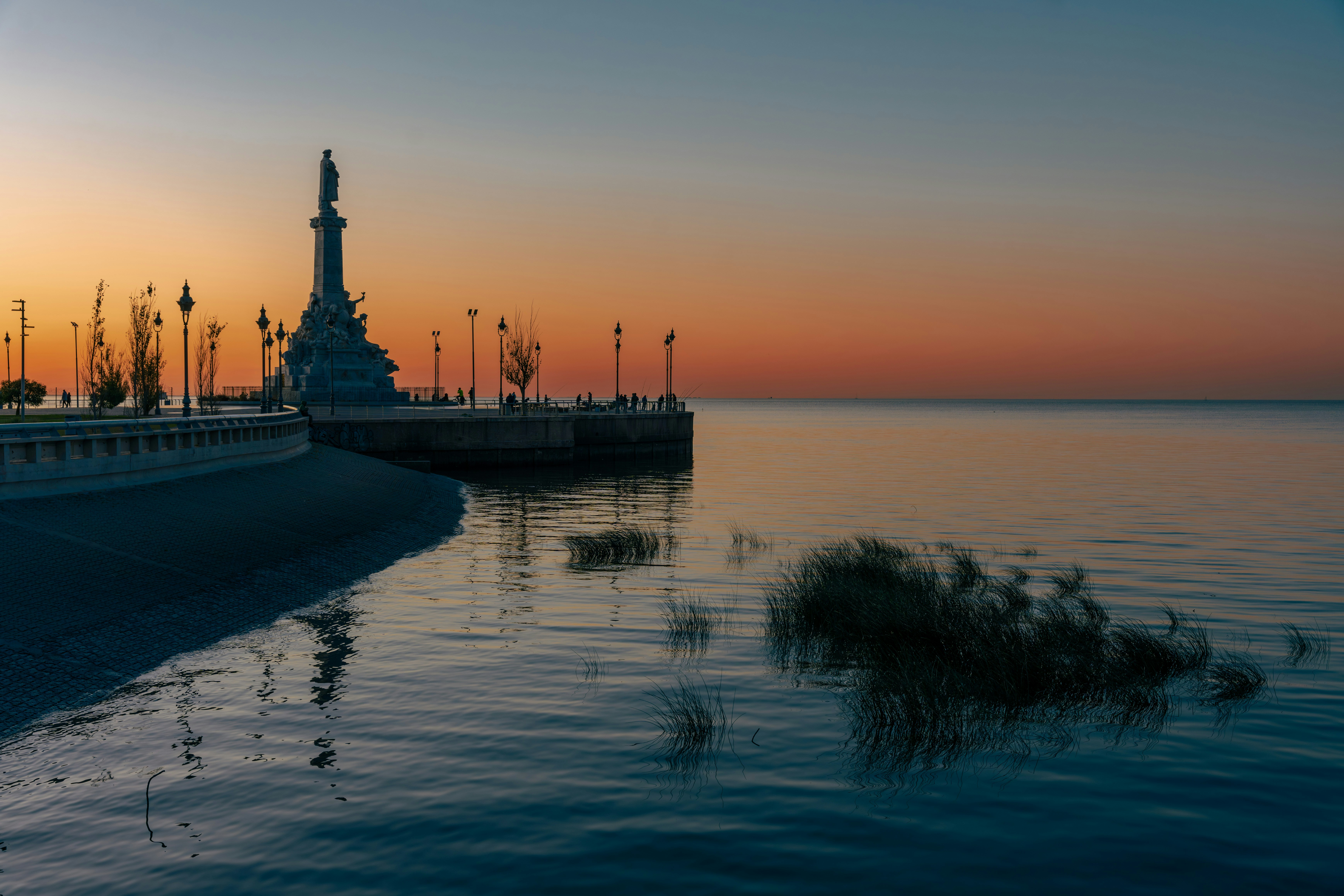 Dawn Sentinel on a Lanterned Seaside Pier