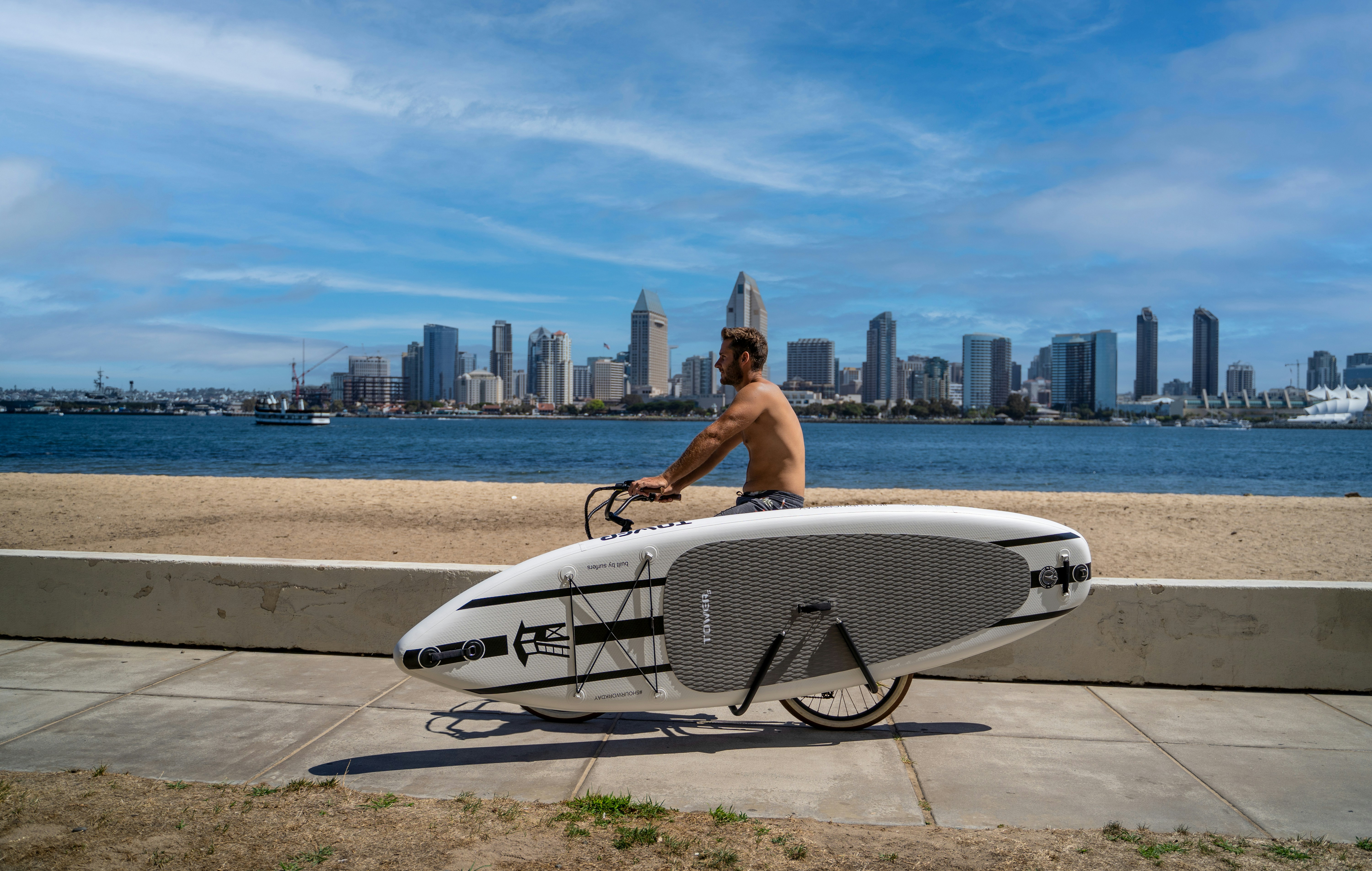 Surfboard Guardian: A Lone Rider Returns Along San Diego Bay