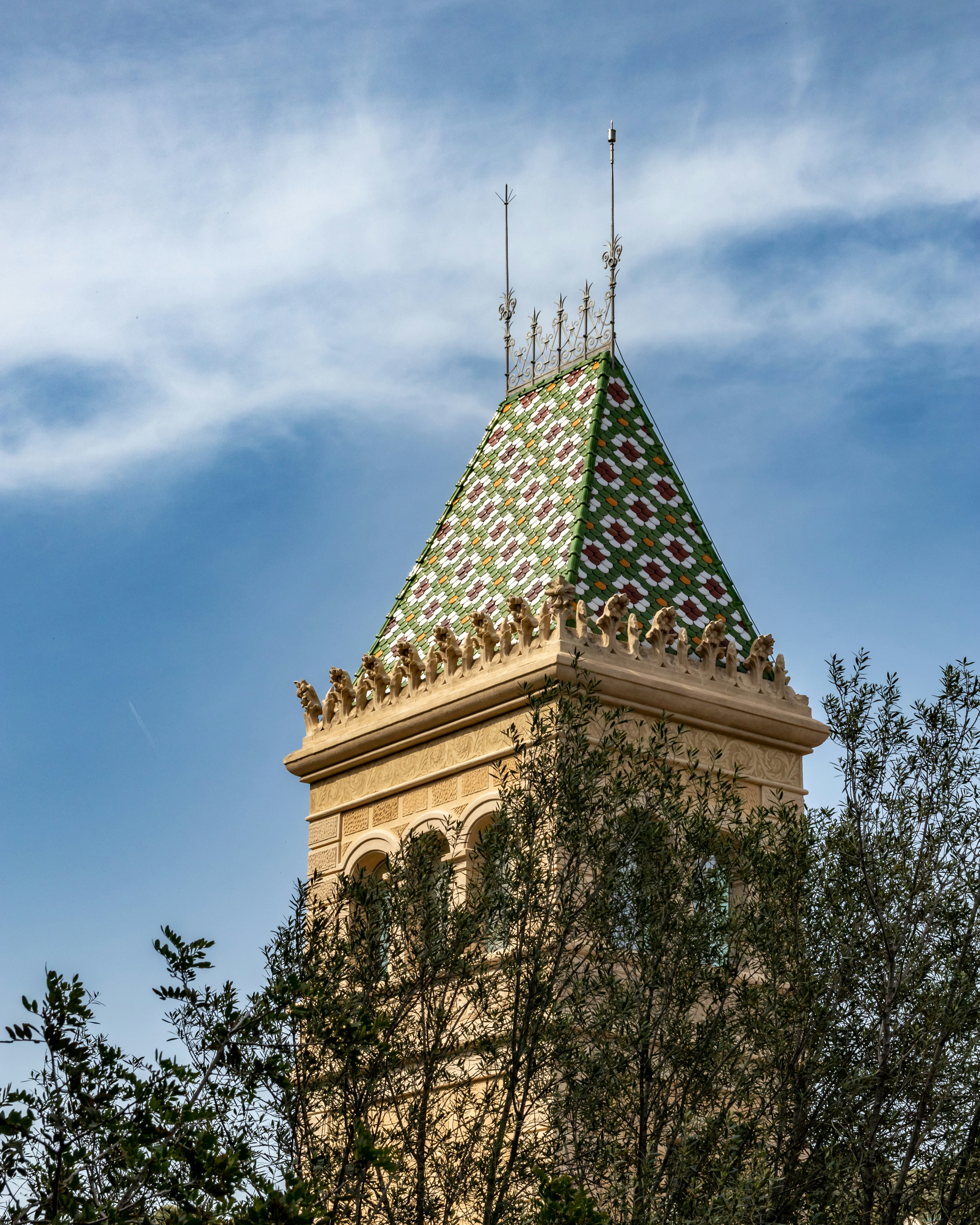 Ornate Tower Amidst Verdant Foliage