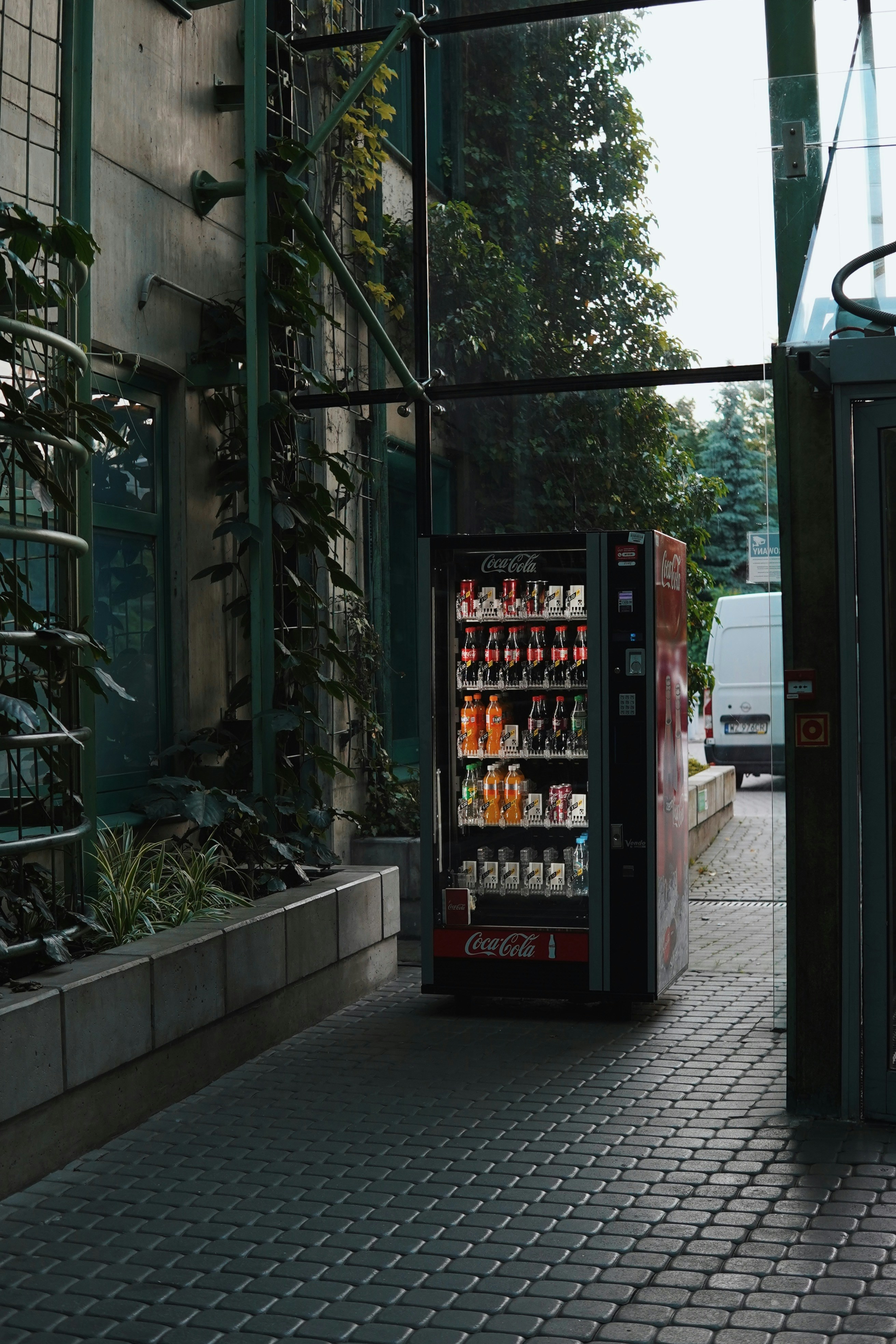 A vending machine sitting on the side of a road photo – Free Car Image ...