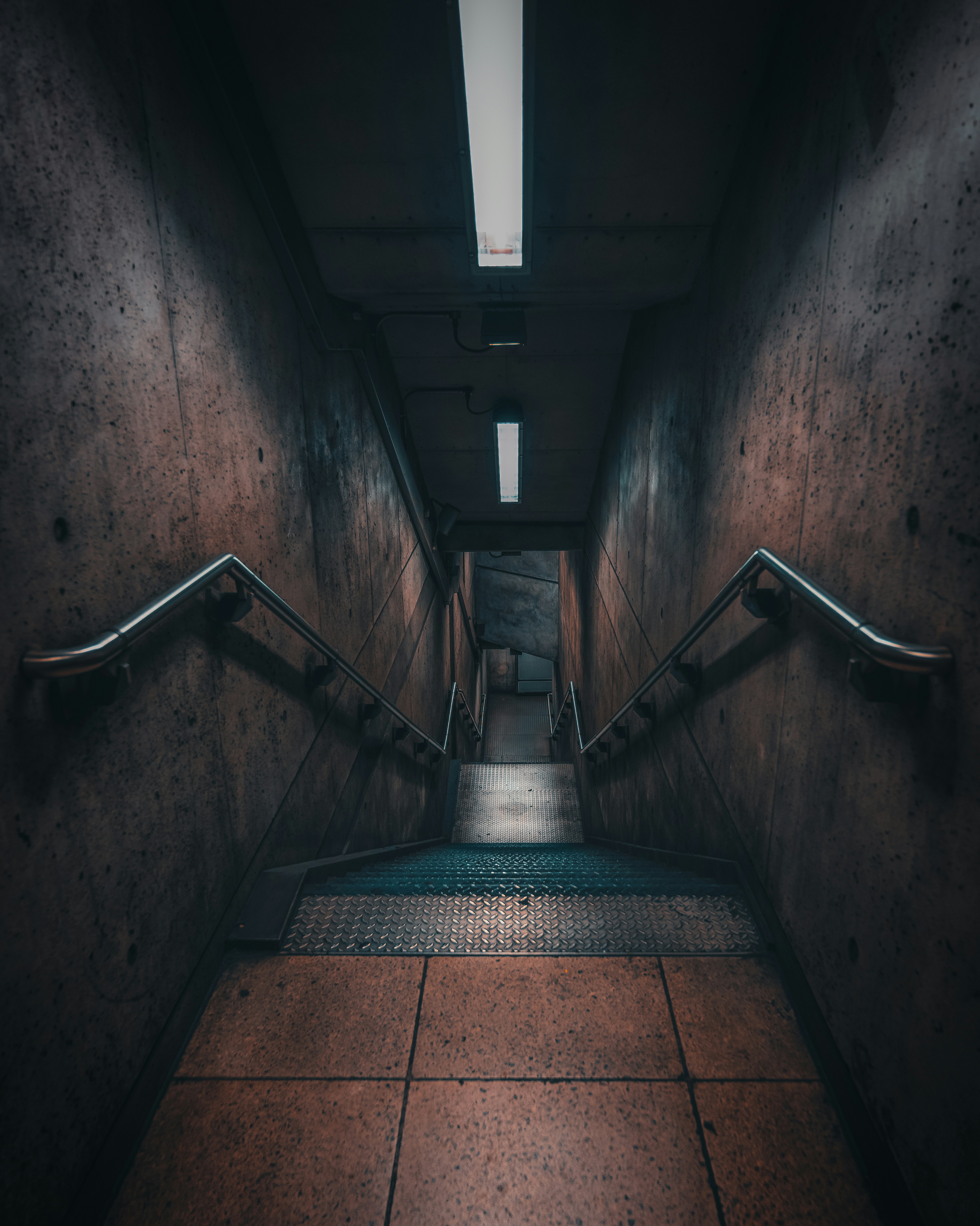 A long hallway with a metal hand rail photo – Free Cyberpunk Image on ...