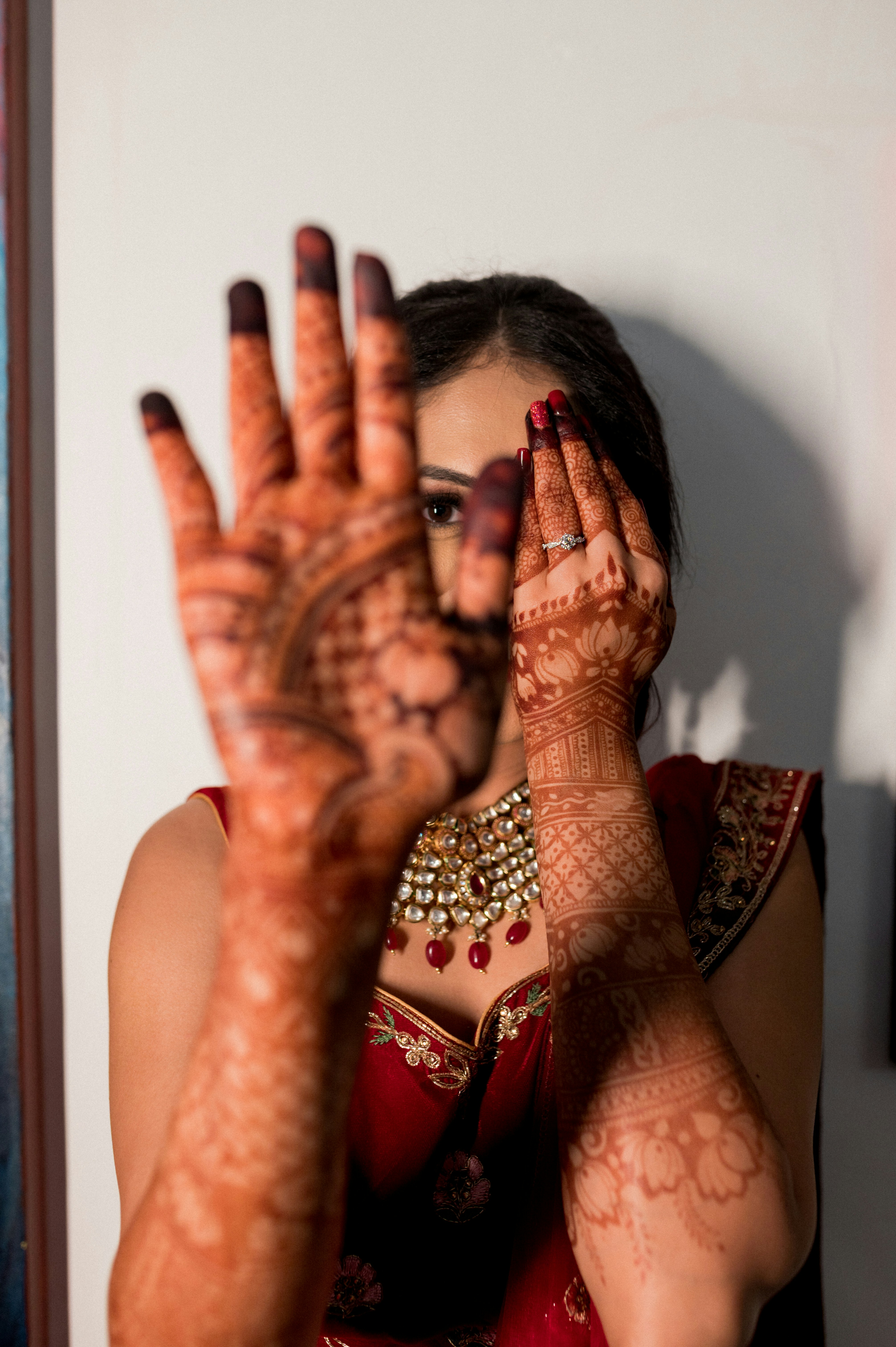 Gaze Through the Hands: A Bride's Henna-etched Moment
