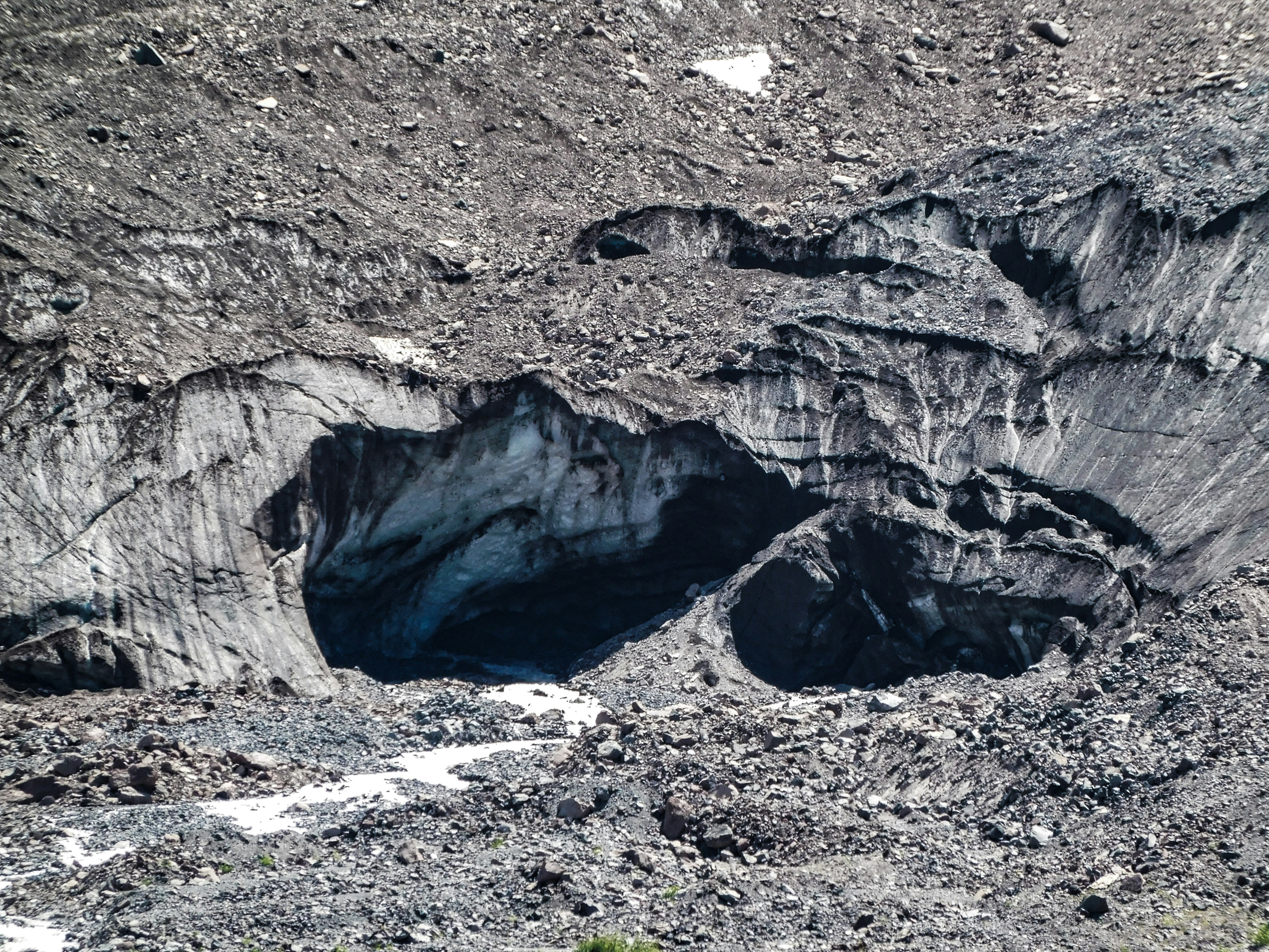 A very large hole in the side of a mountain photo – Free Emmons glacier ...