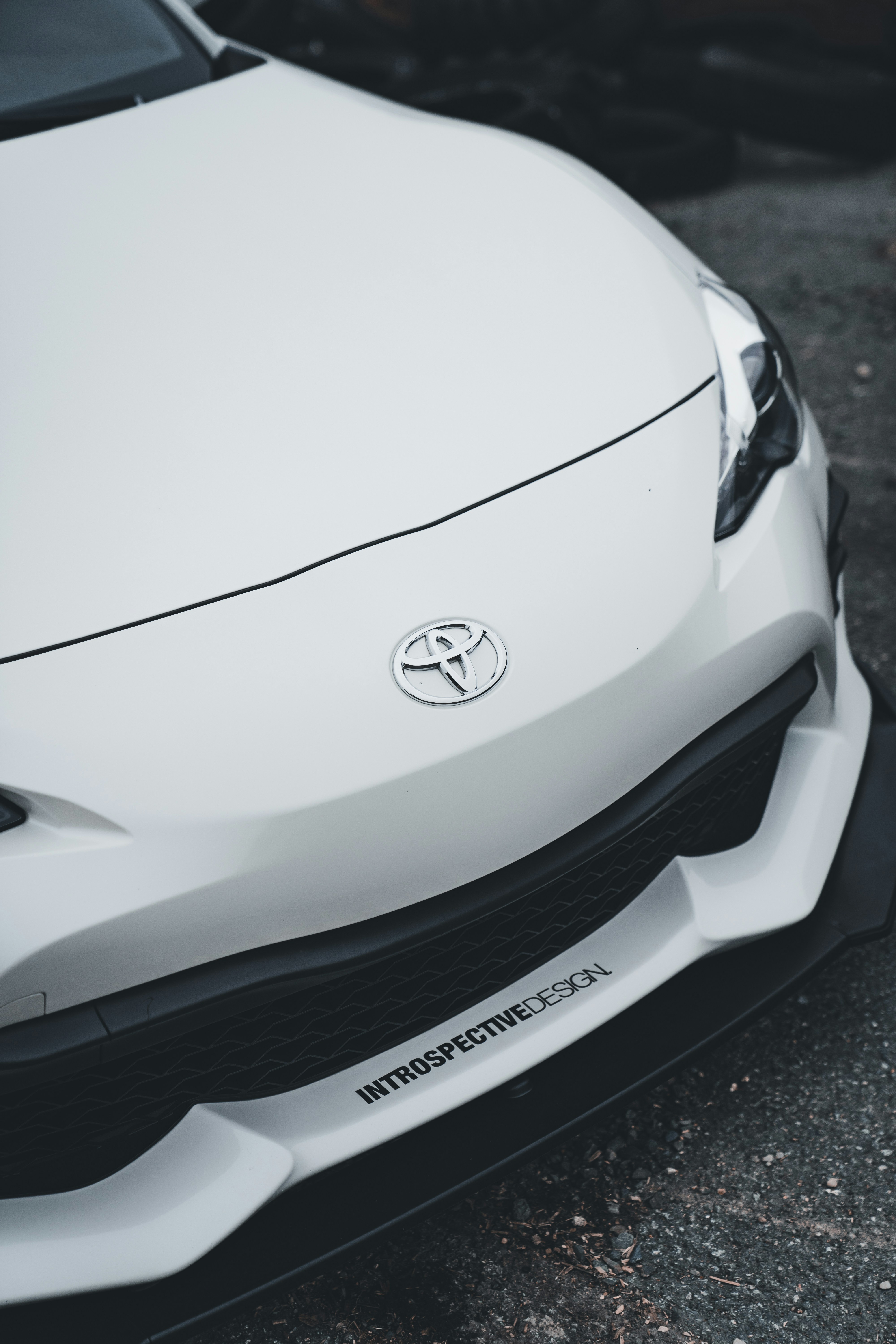 Sculpted Silence: The Bold Front of a White Toyota
