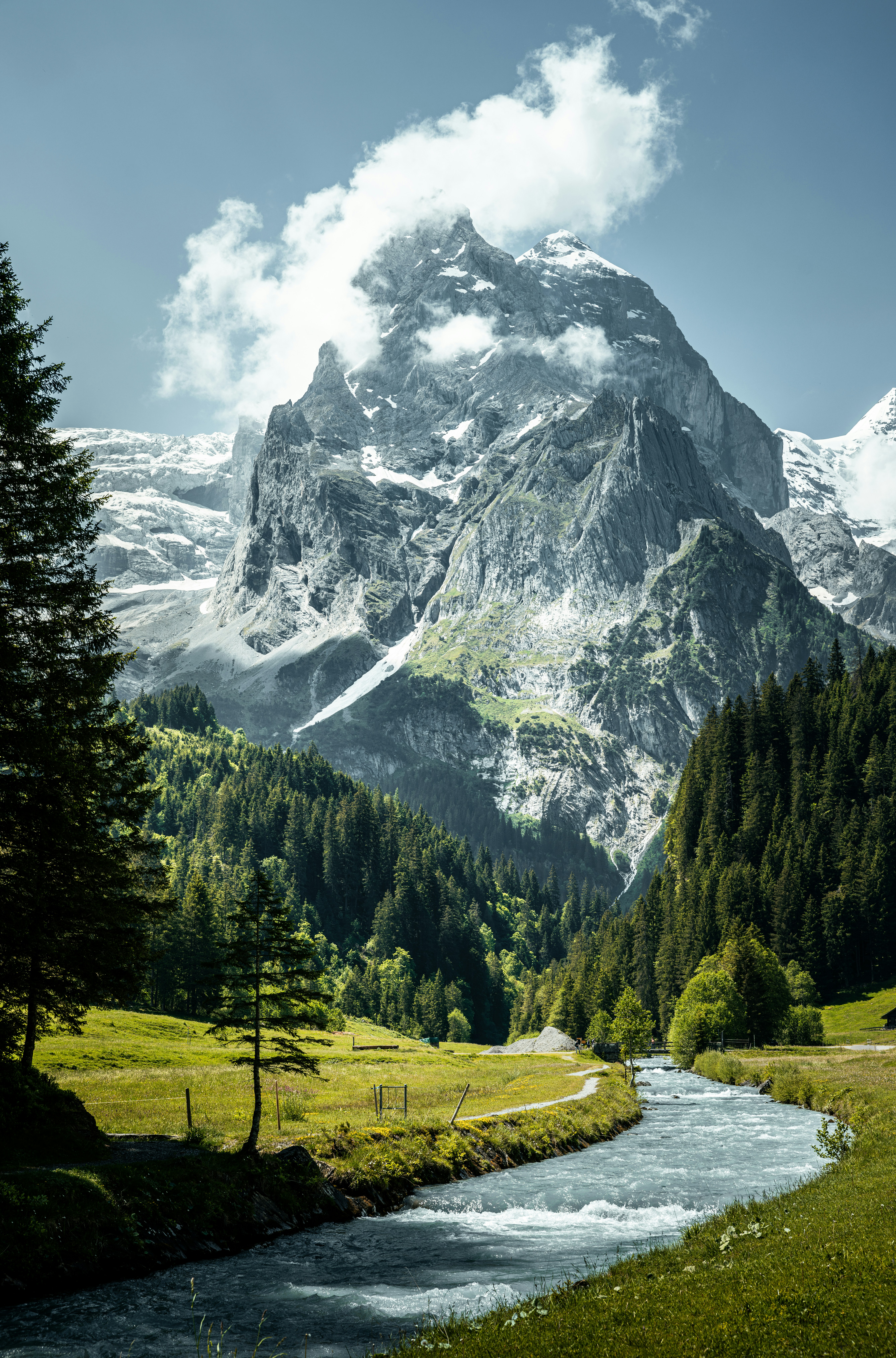 A mountain with a river running through it photo – Free Rosenlaui Image ...
