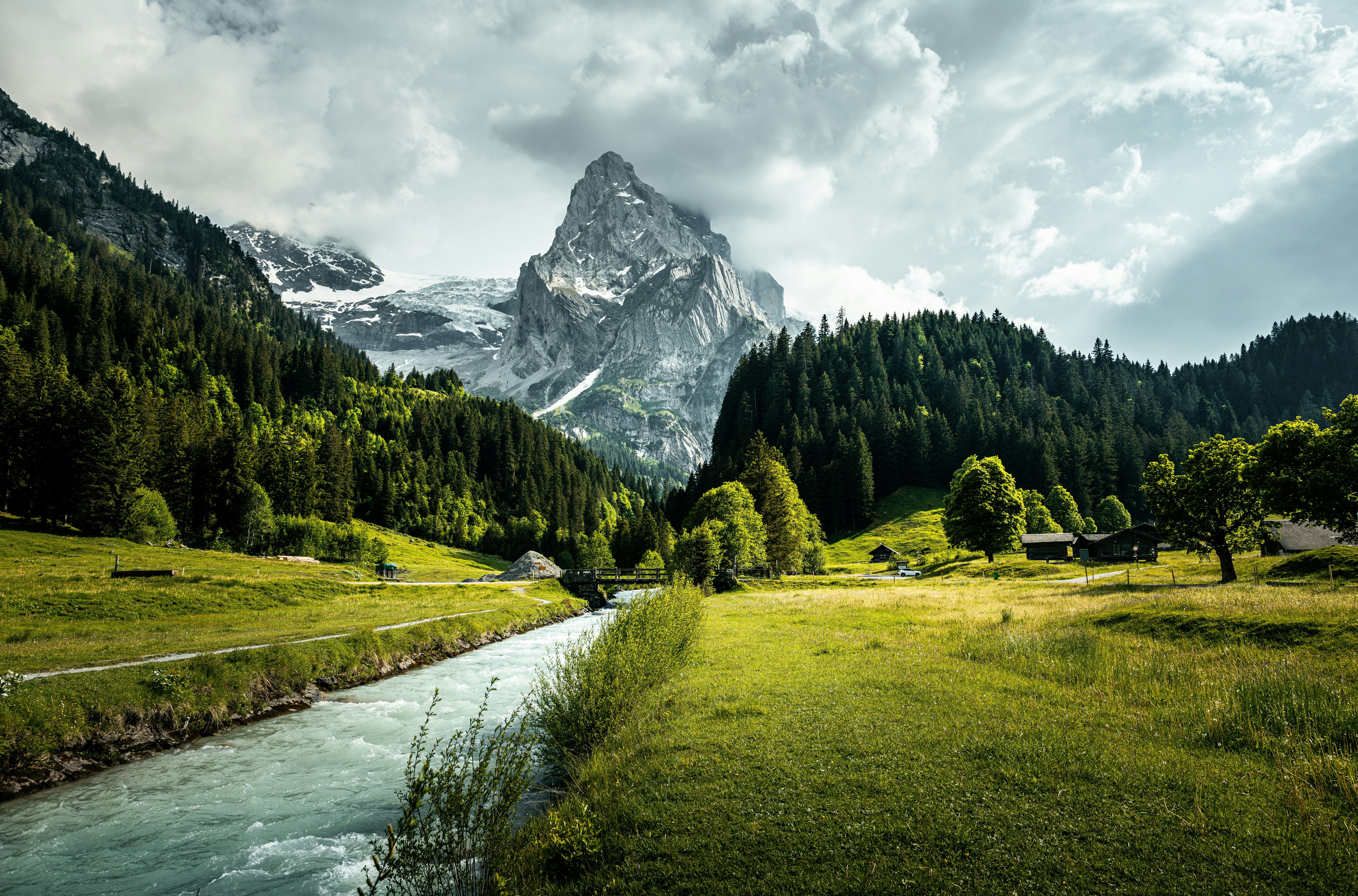A mountain with a river running through it photo – Free Rosenlaui Image ...