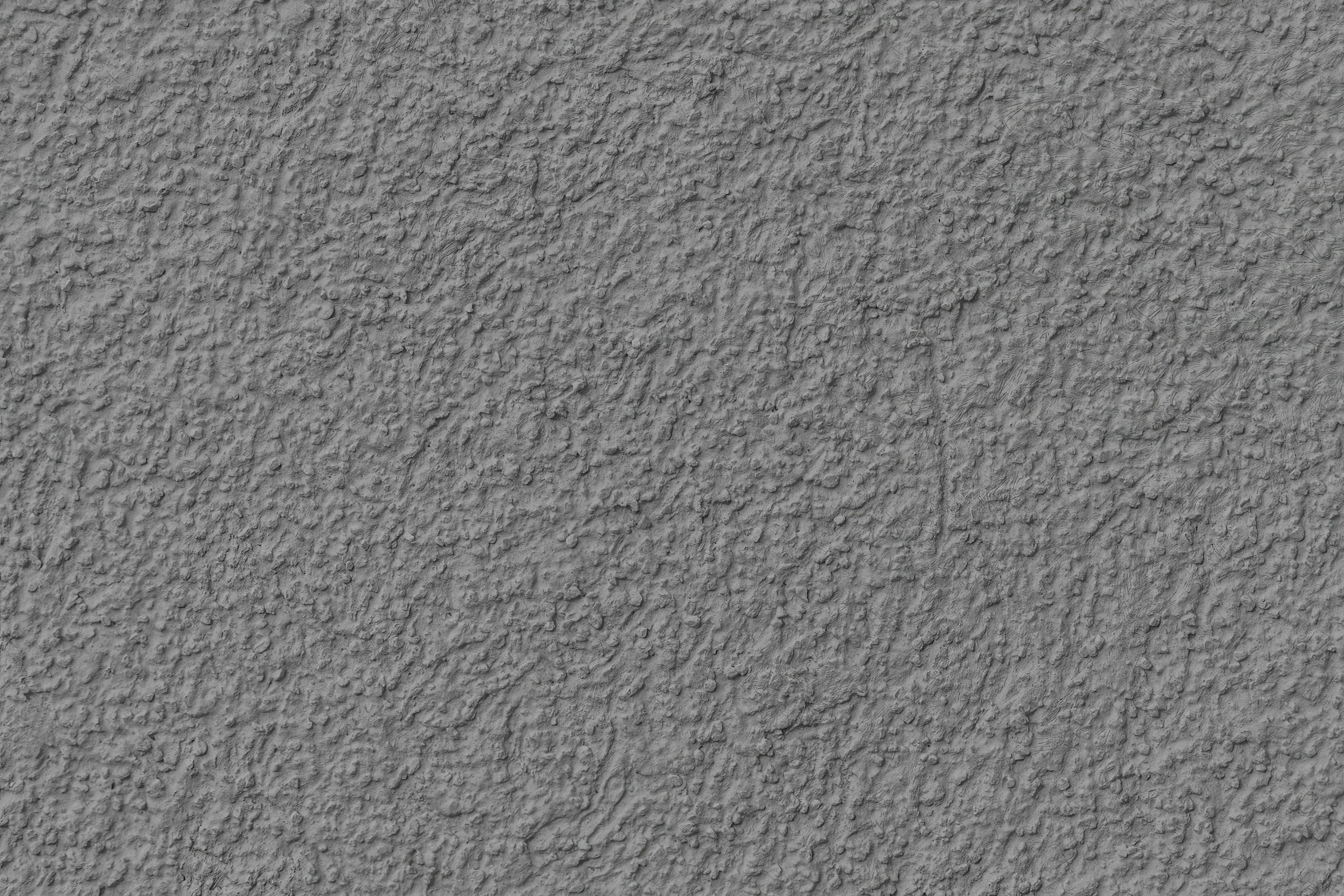 A close up view of a gray stucco wall photo – Free Texture Image on ...