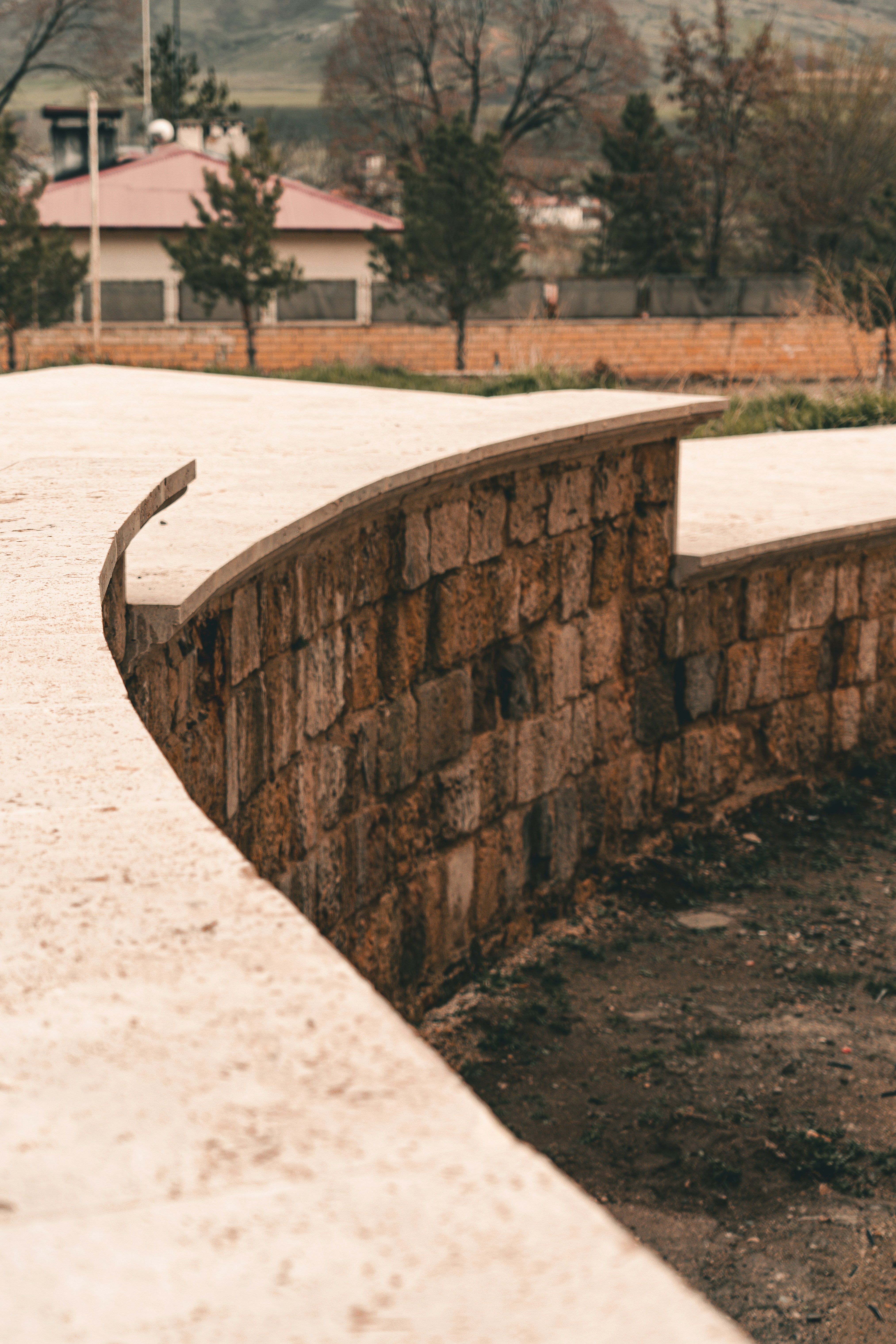 Stone Bridge Edge Framing a Quiet Riverside