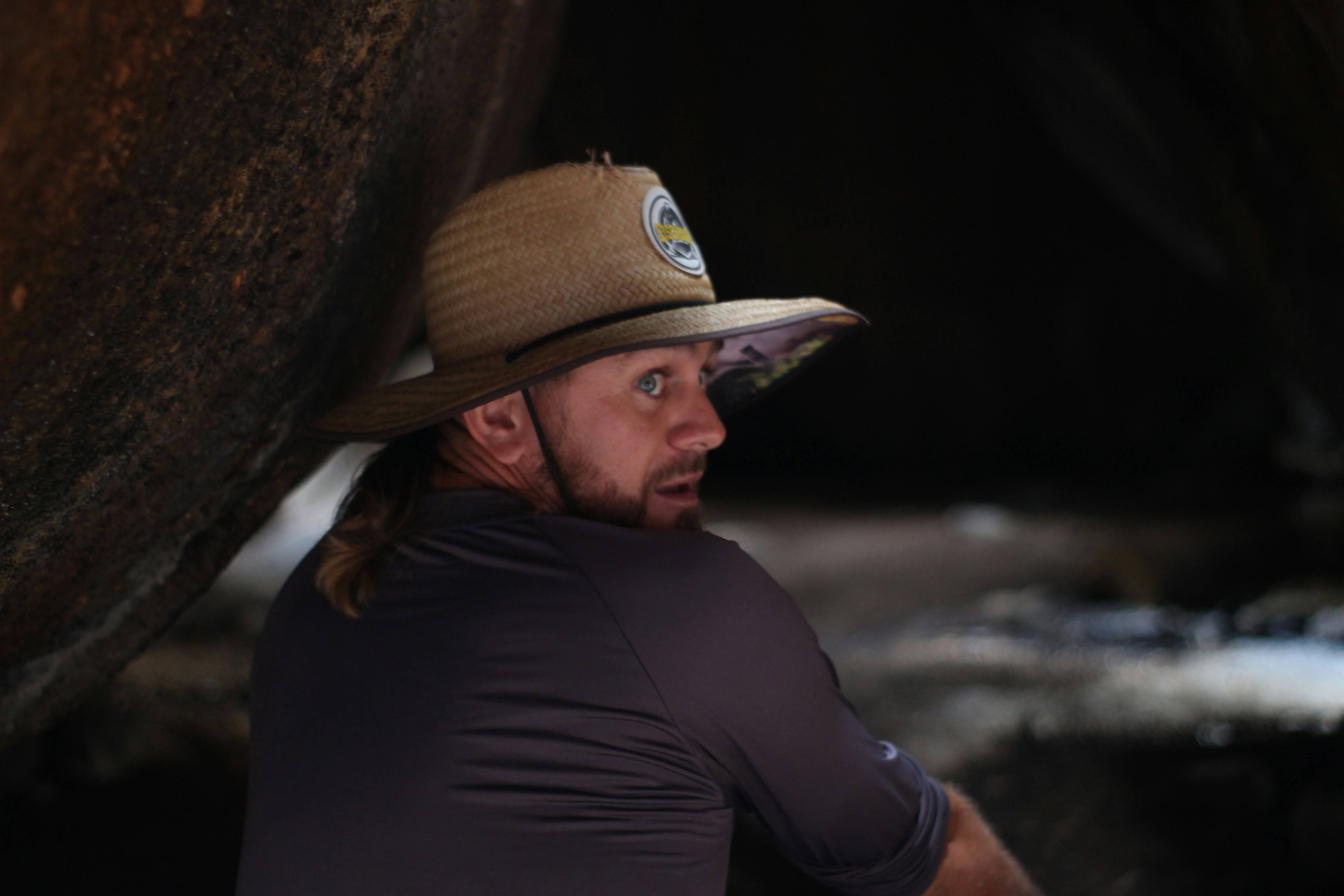 Grotto Gaze: Quiet Focus in a Shadowed Rock Crevice