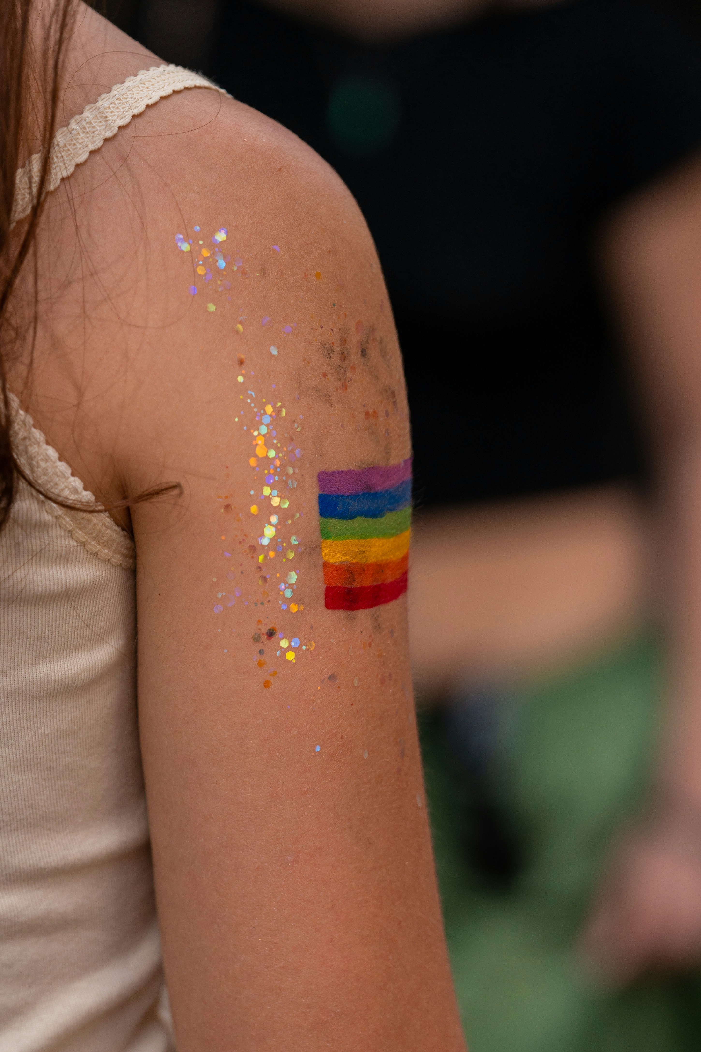 A woman with a rainbow painted on her arm photo – Free Zürich Image on ...