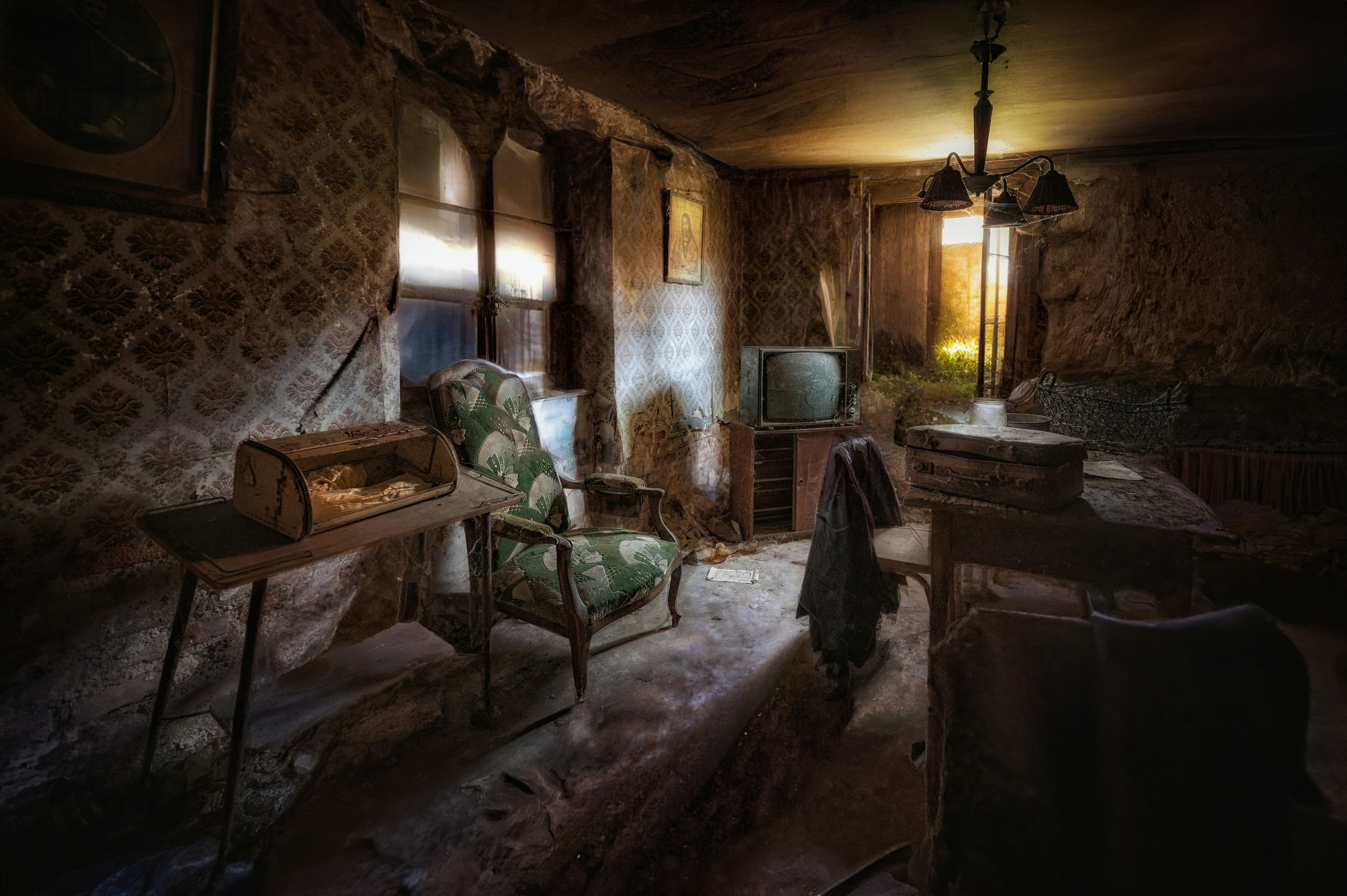 A dark room with a chair, desk and television photo – Free Interior ...