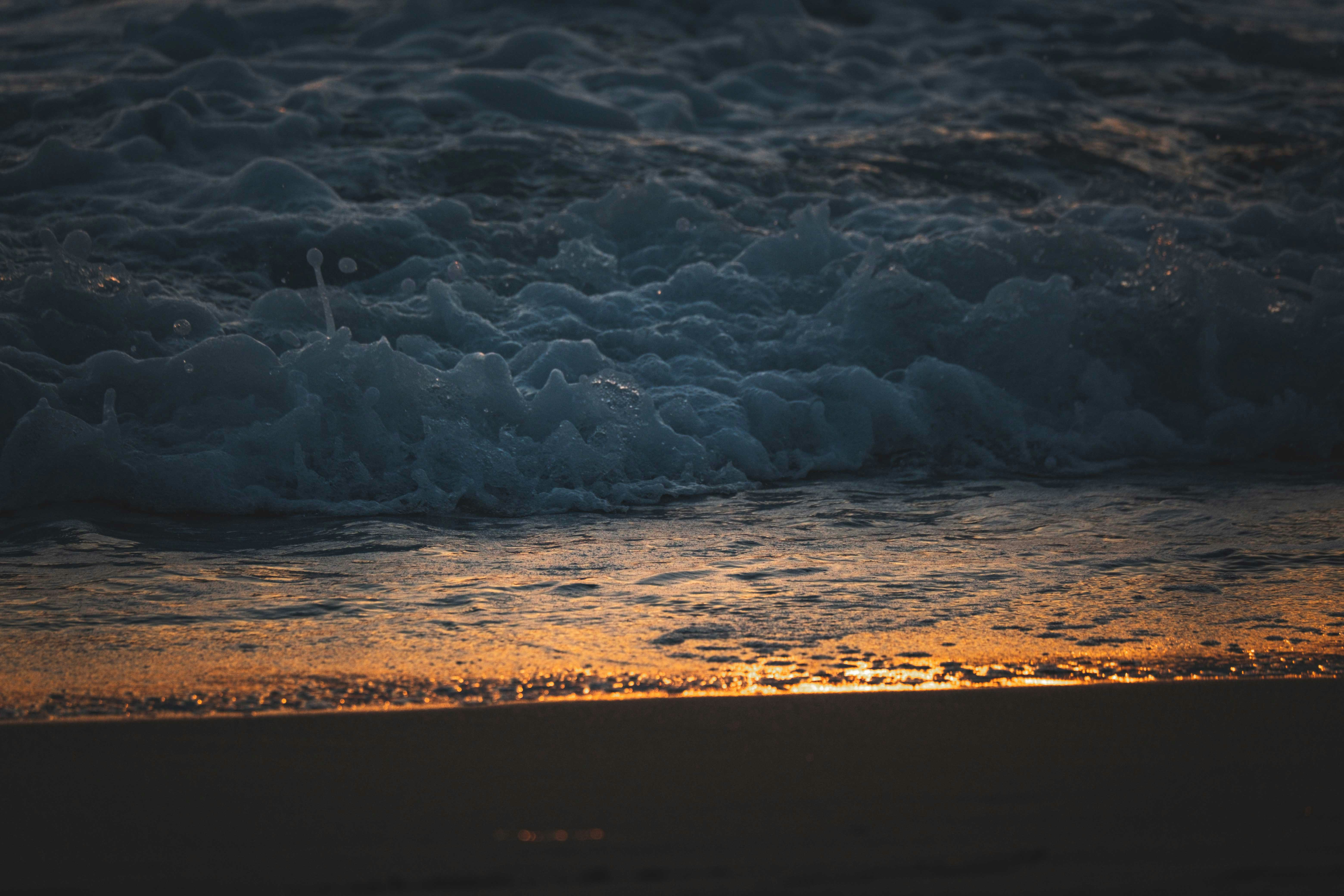 Gilded Crest: Foamy Edge of a Quiet Dusk Shore