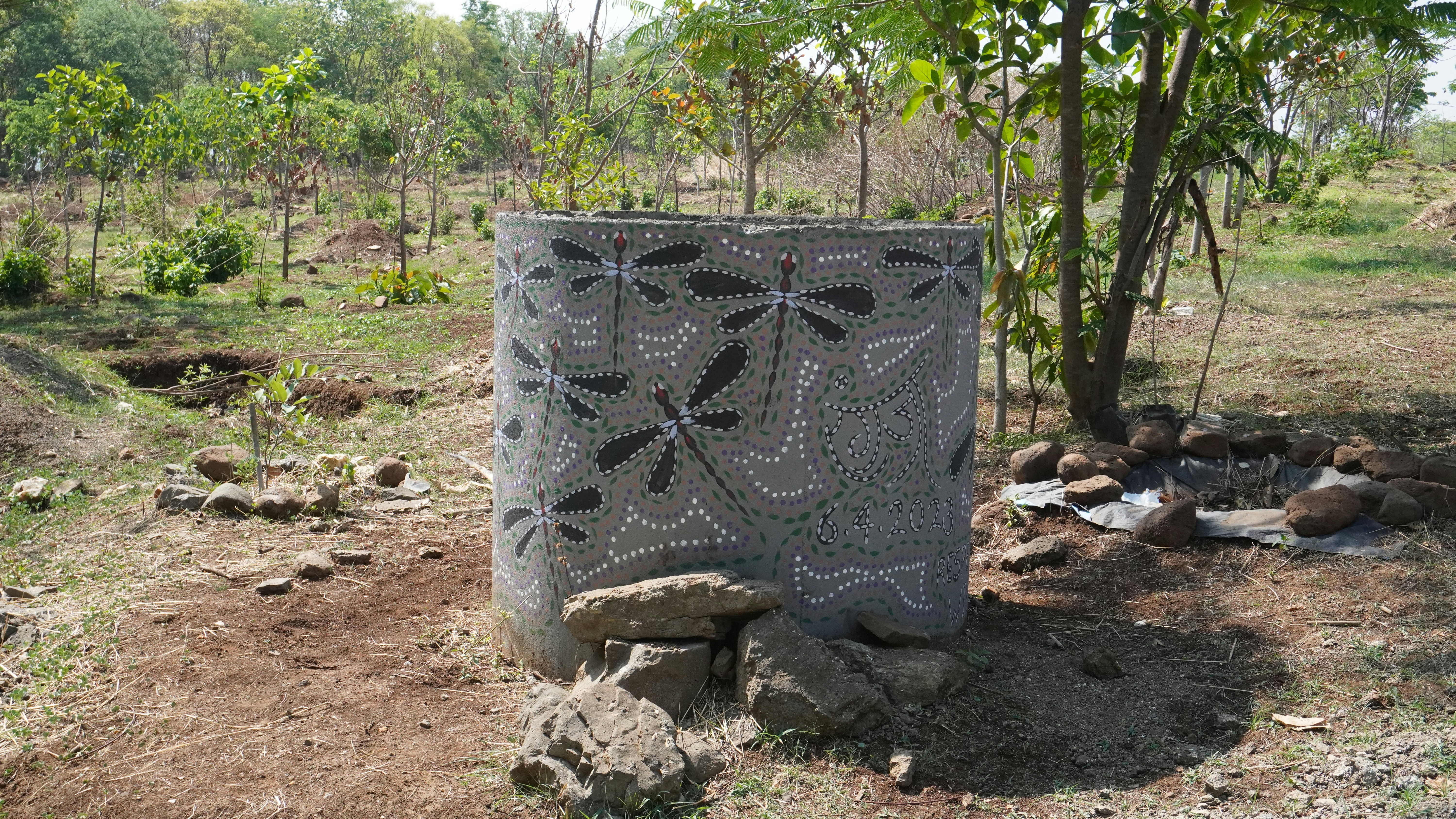 Orchard Screen: Sunlit Concrete Panel with Perforated Floral Motifs