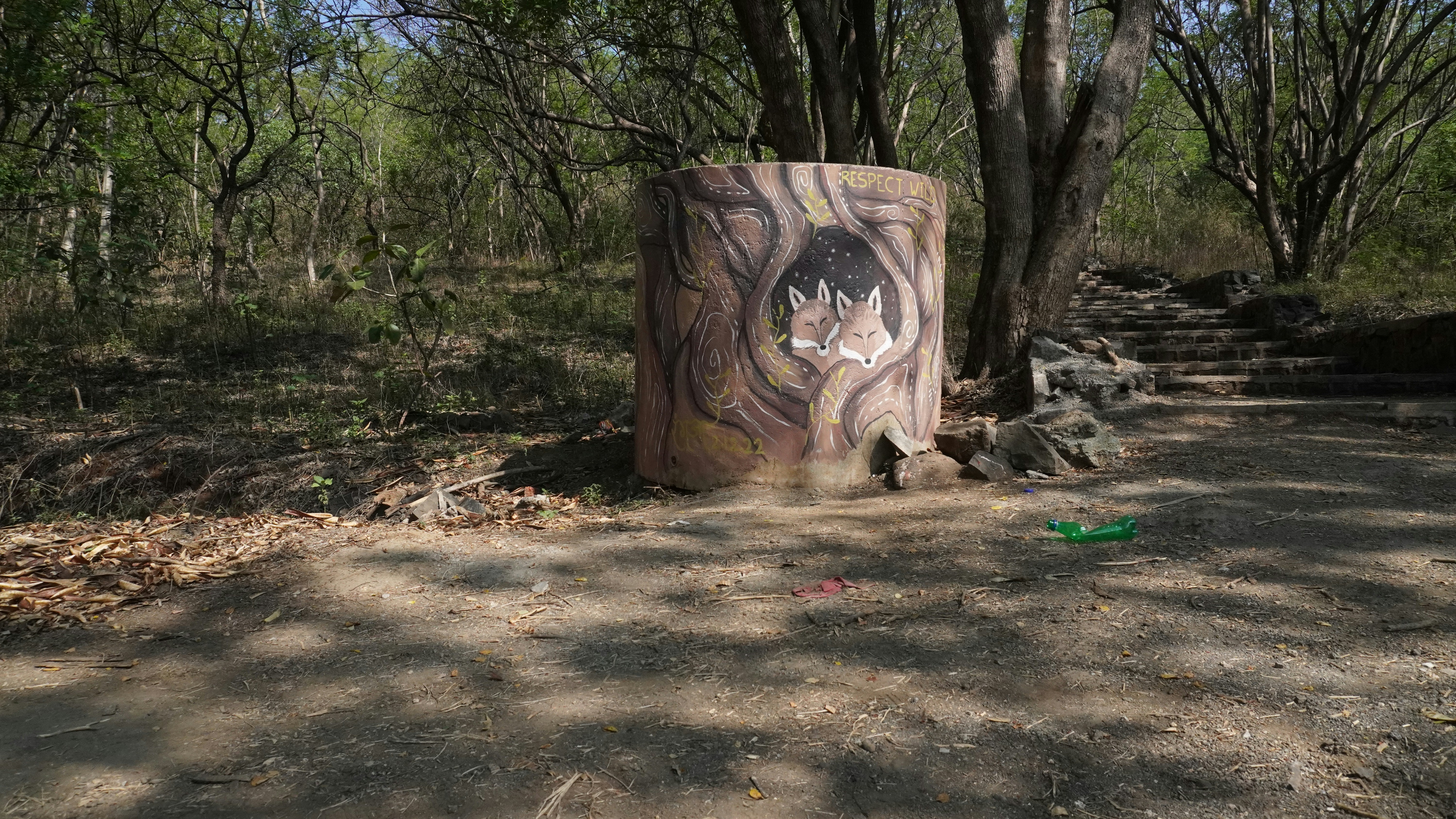 A tree stump in the middle of a dirt road photo – Free Land Image on ...
