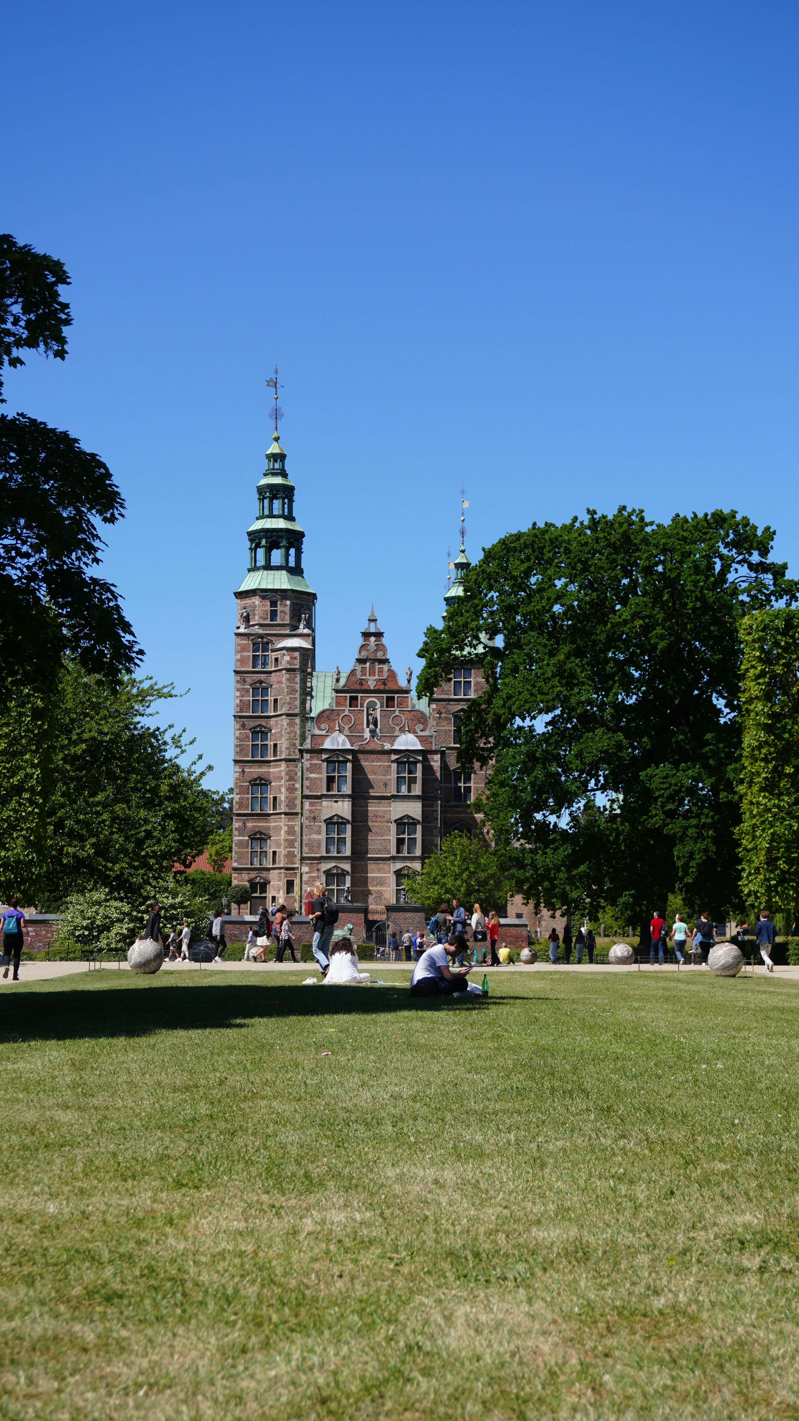 Castle in the Park: A Sunlit Moment Before the Crowd
