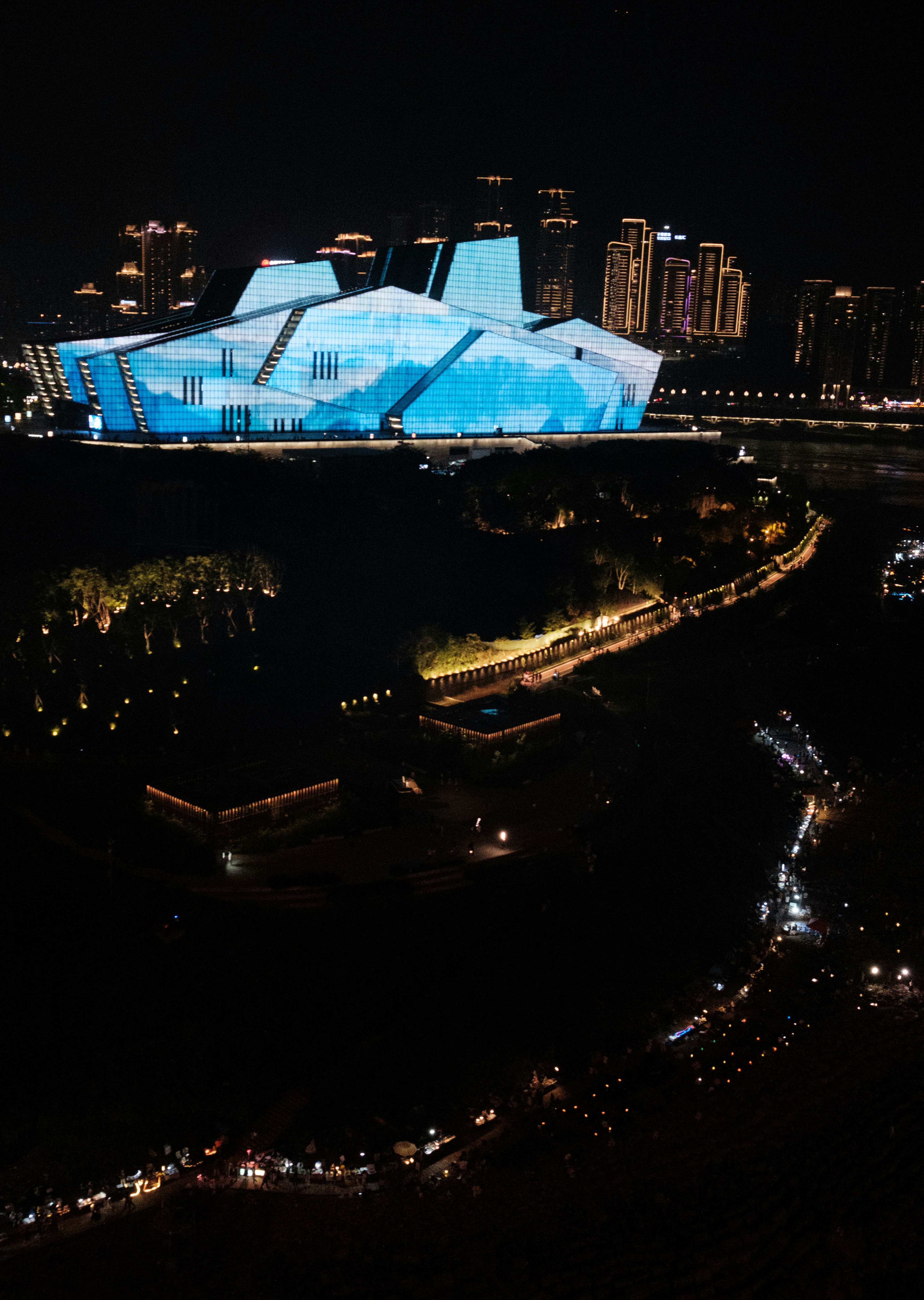 An aerial view of a building lit up at night photo – Free Chongqing ...