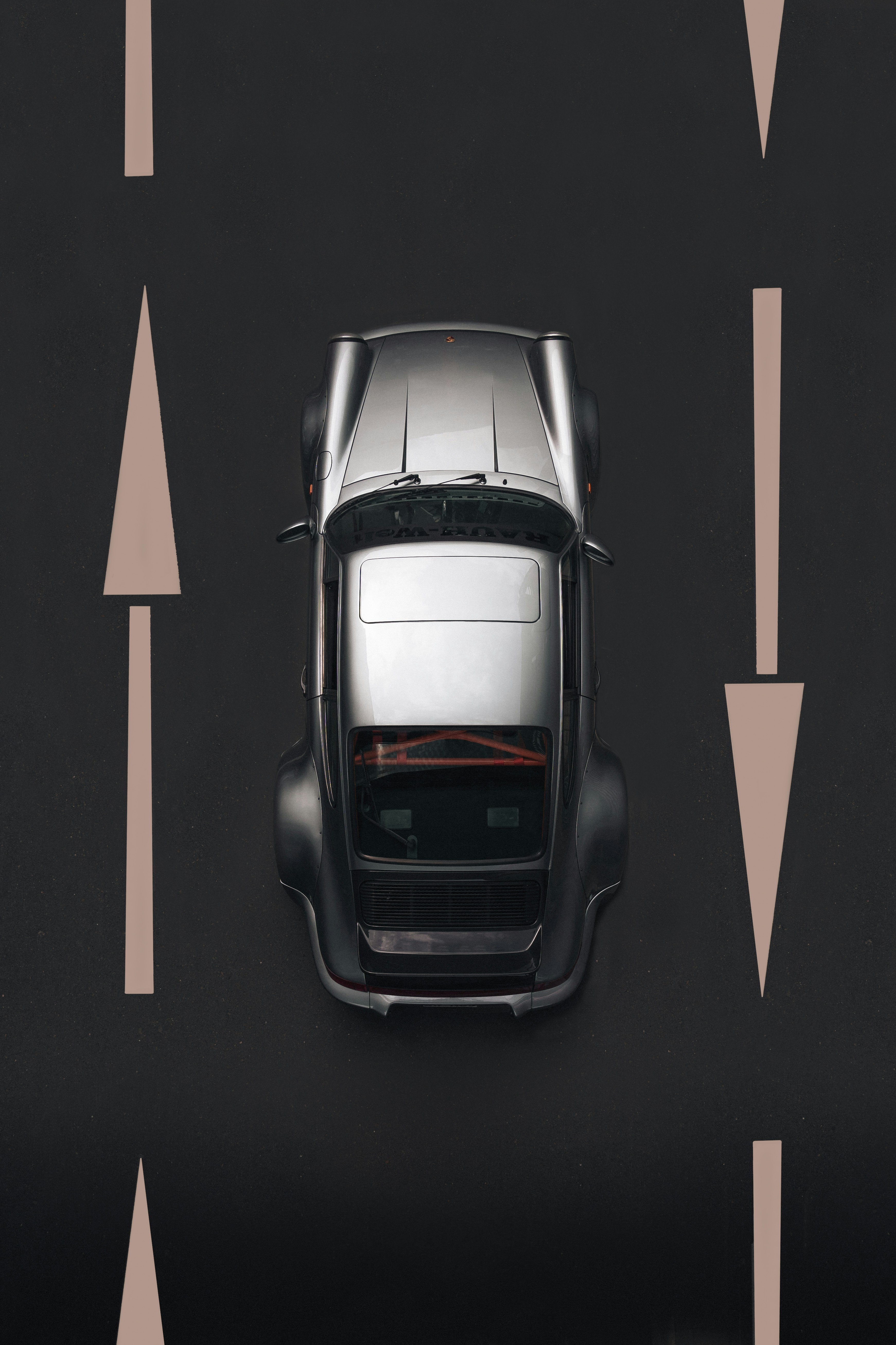 An overhead view of a car driving on a road photo – Free Car Image on ...