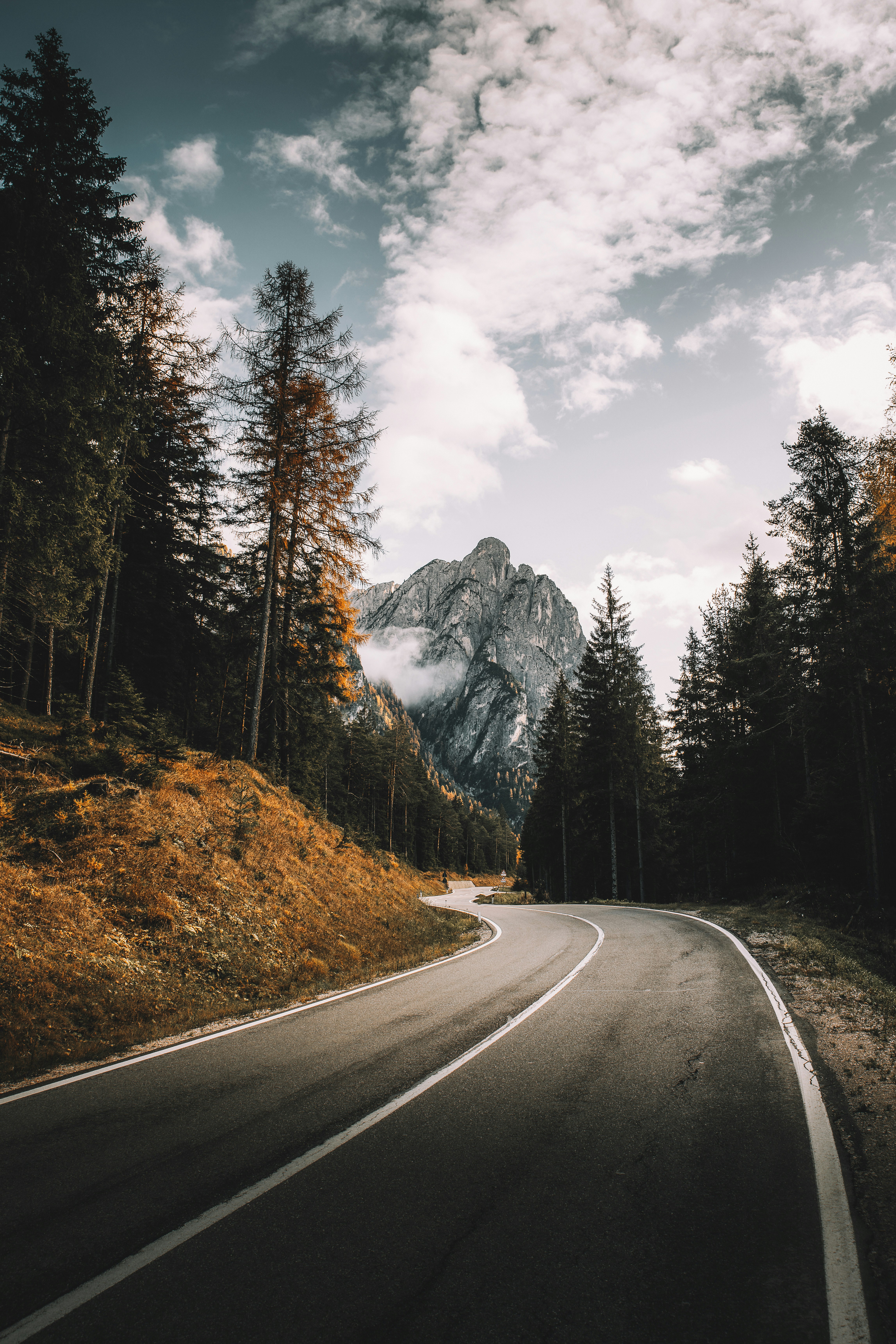 A road with a mountain in the background photo – Free Road Image on ...