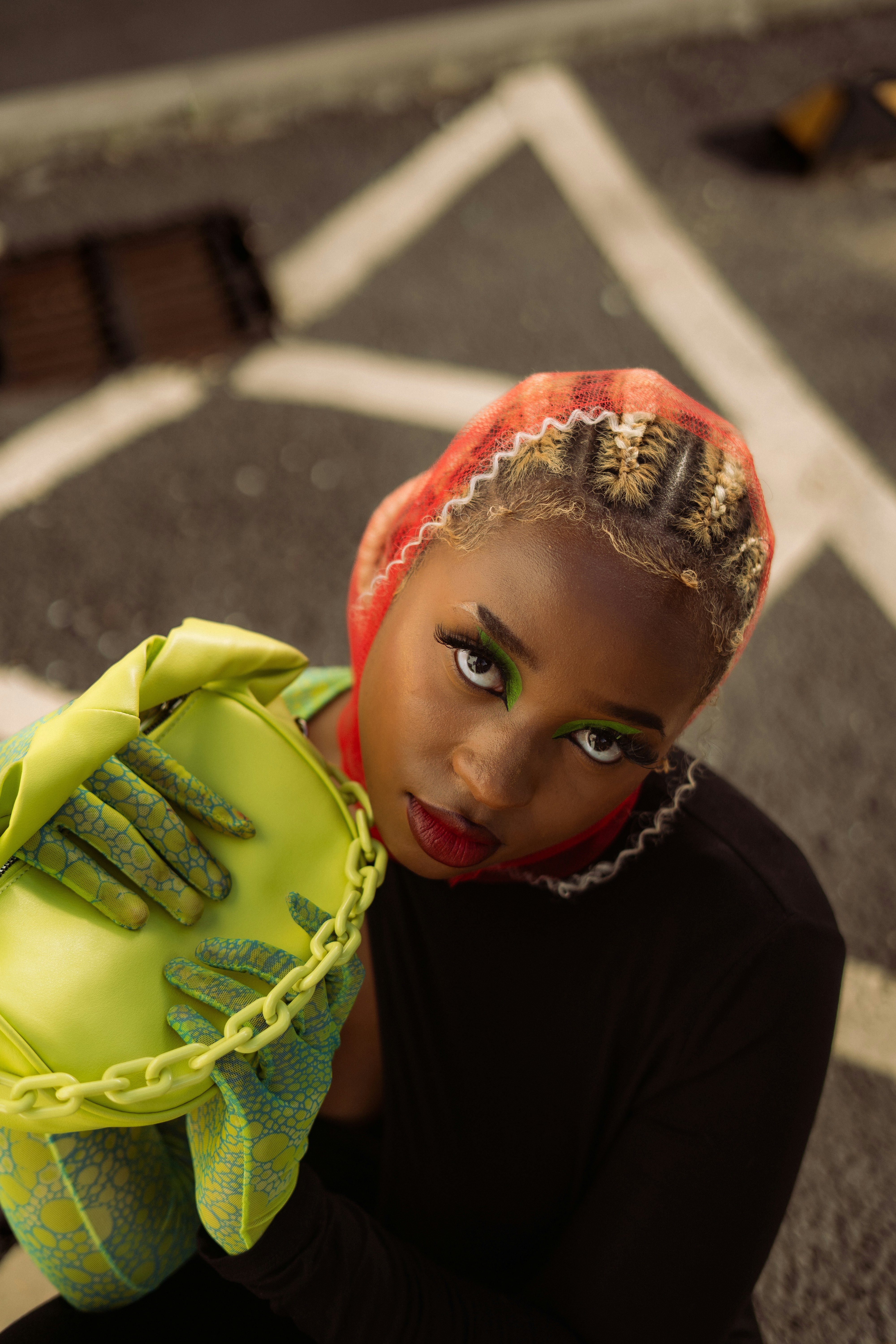 Crimson Hood, Neon Hand: A Street Portrait in Lime Light