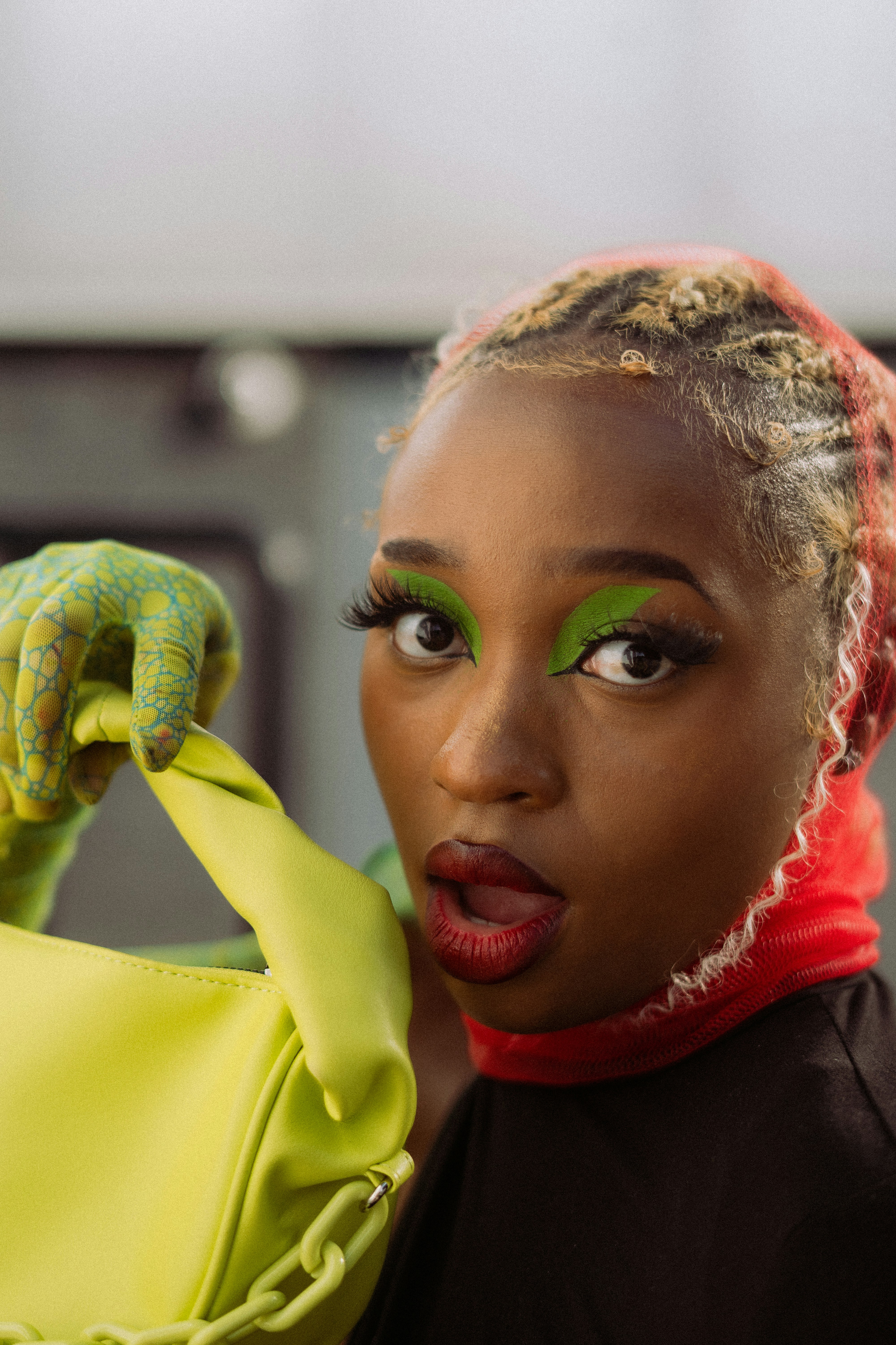 Emerald Eyeliner and Neon Accessories: A Portrait in Color Clash