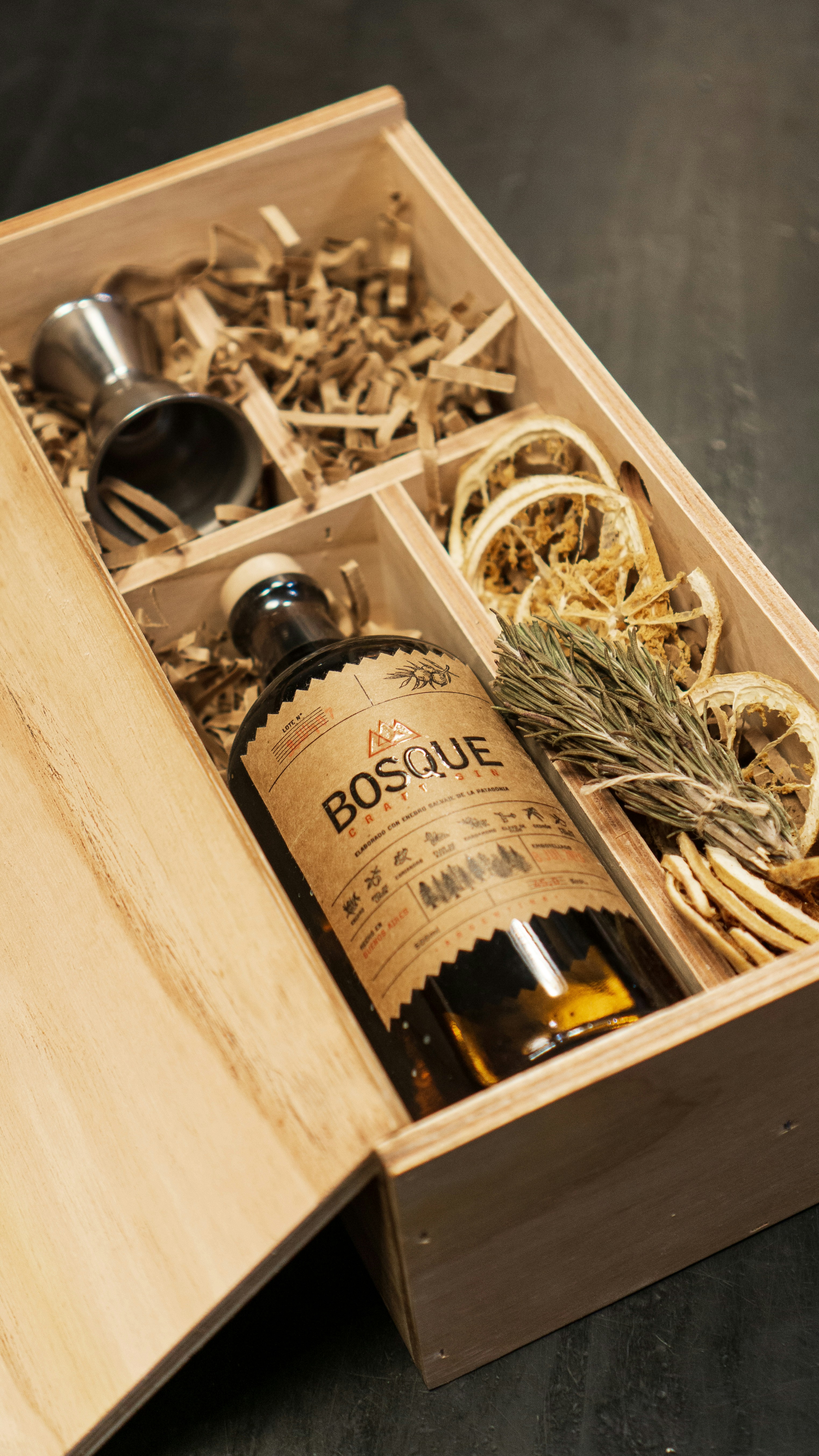 A bottle of booze in a wooden box photo – Free Furniture Image on Unsplash