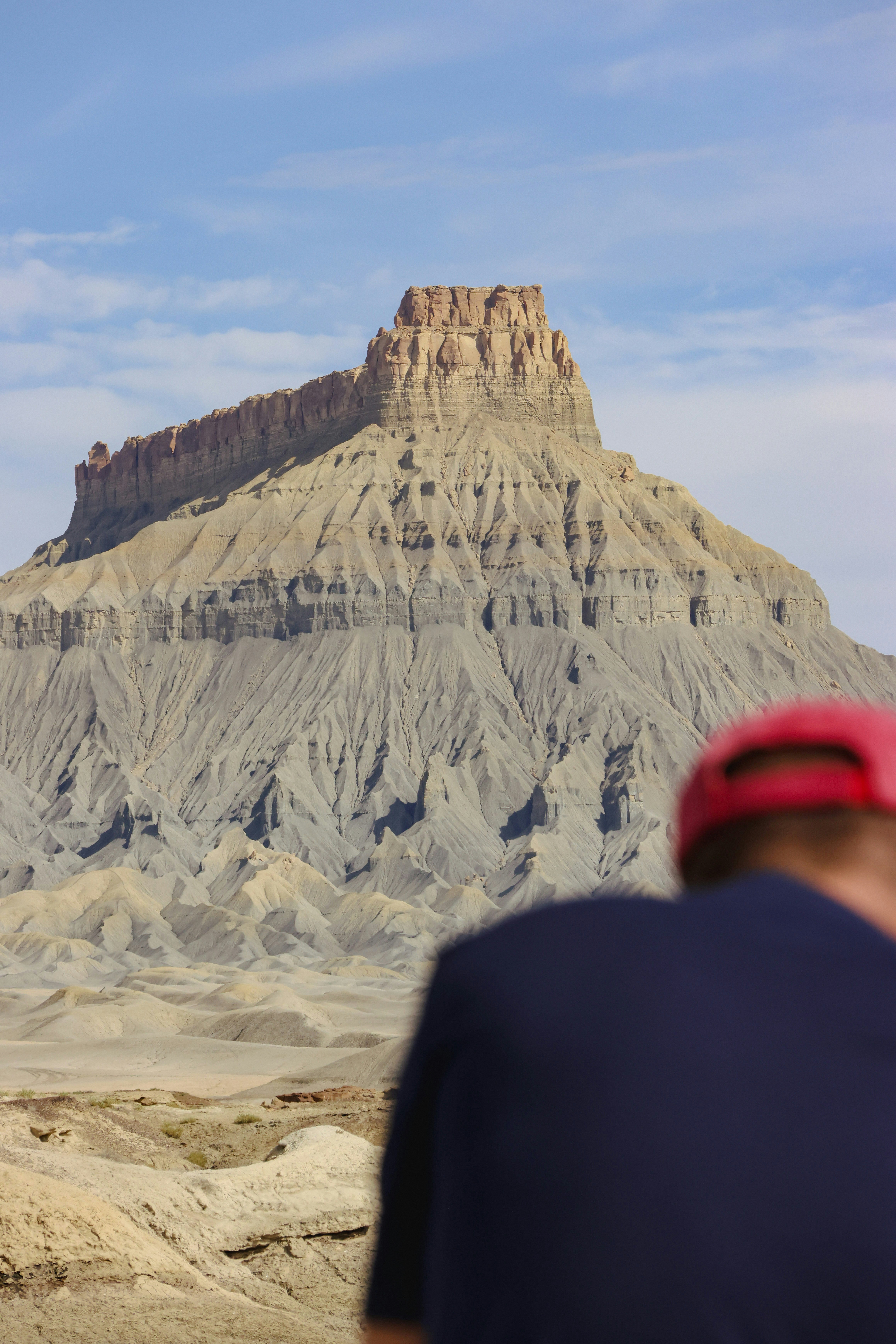 A man standing in front of a mountain photo – Free Factory butte Image ...