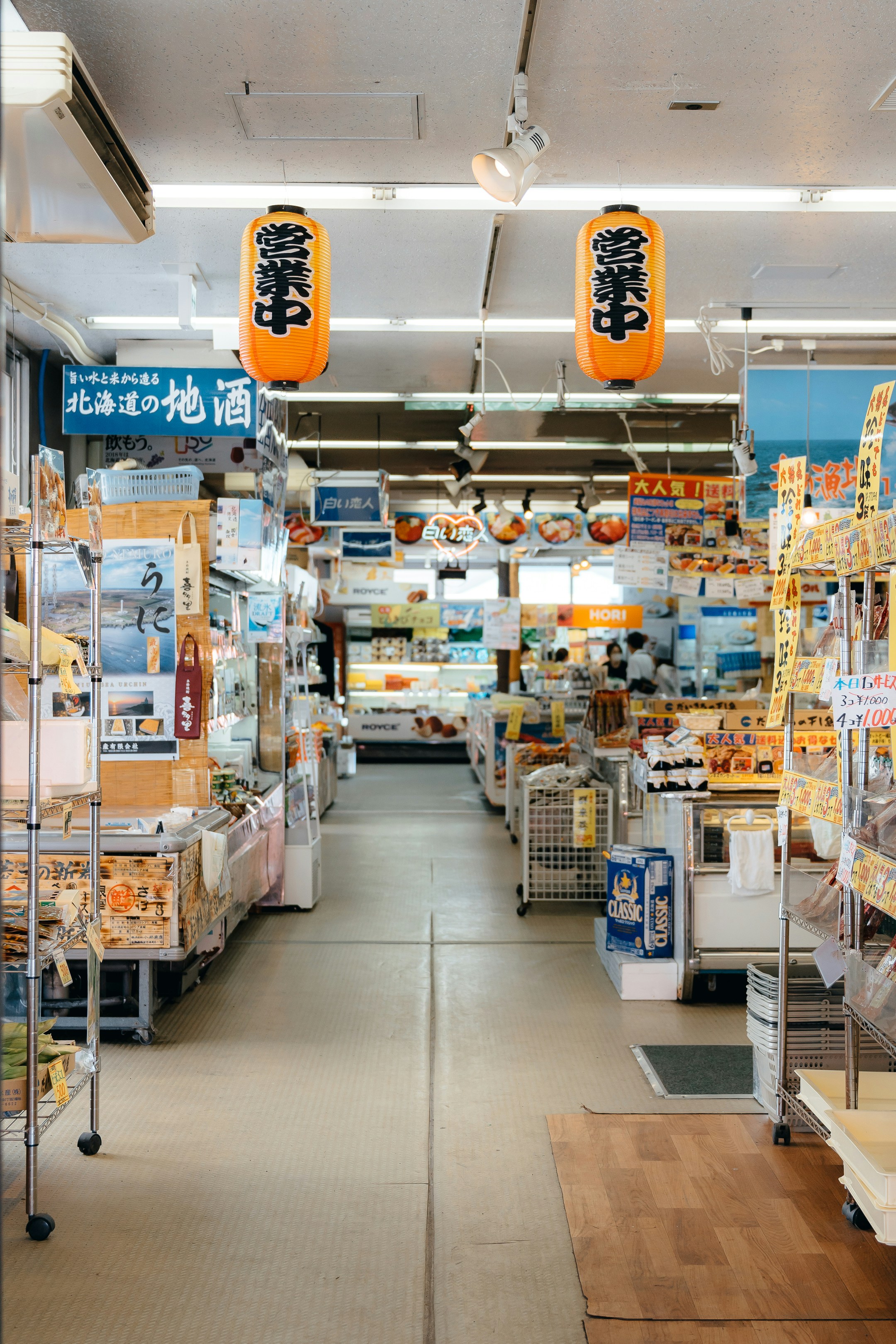 A store filled with lots of different types of goods photo – Free ...