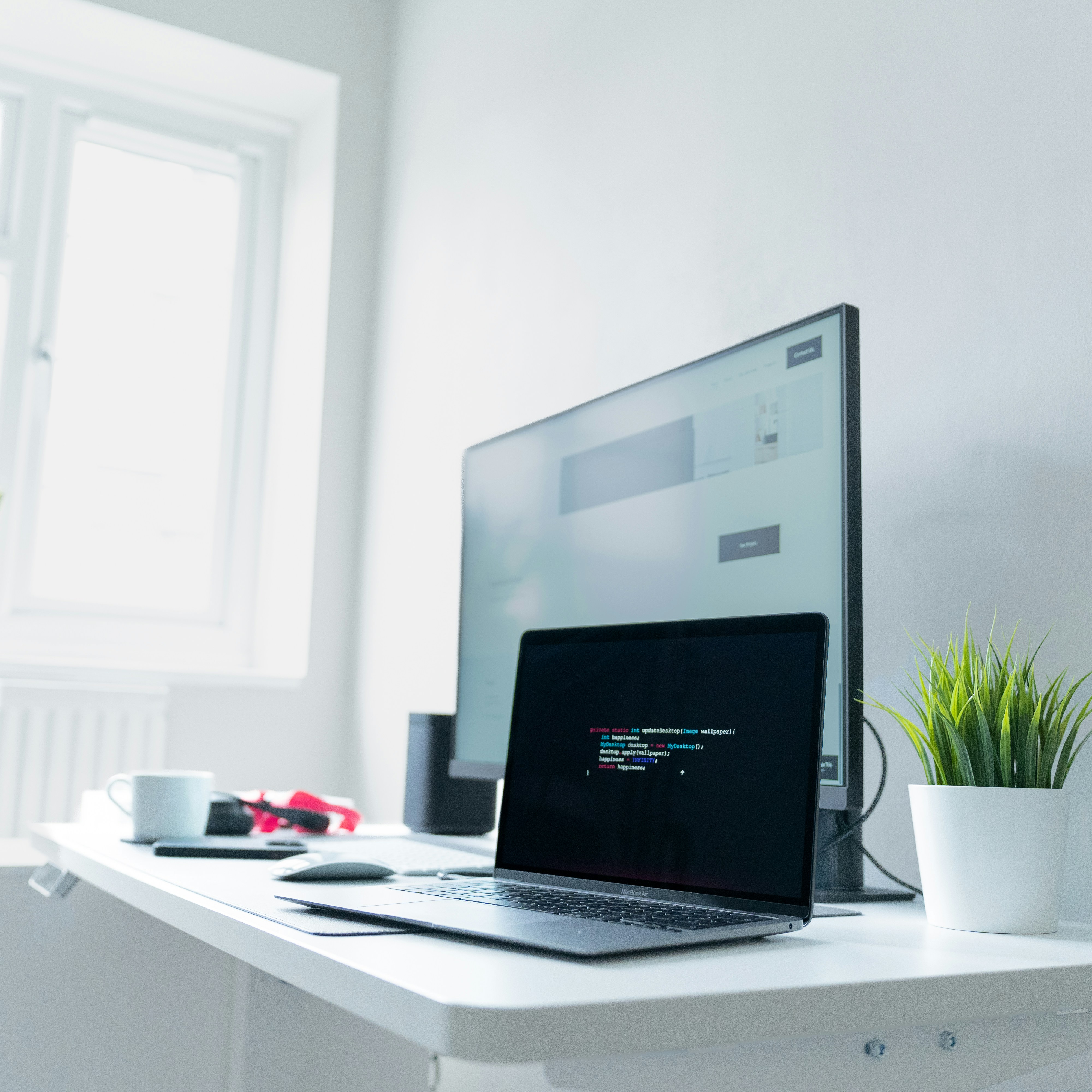 A laptop computer sitting on top of a white desk photo – Free Computer ...