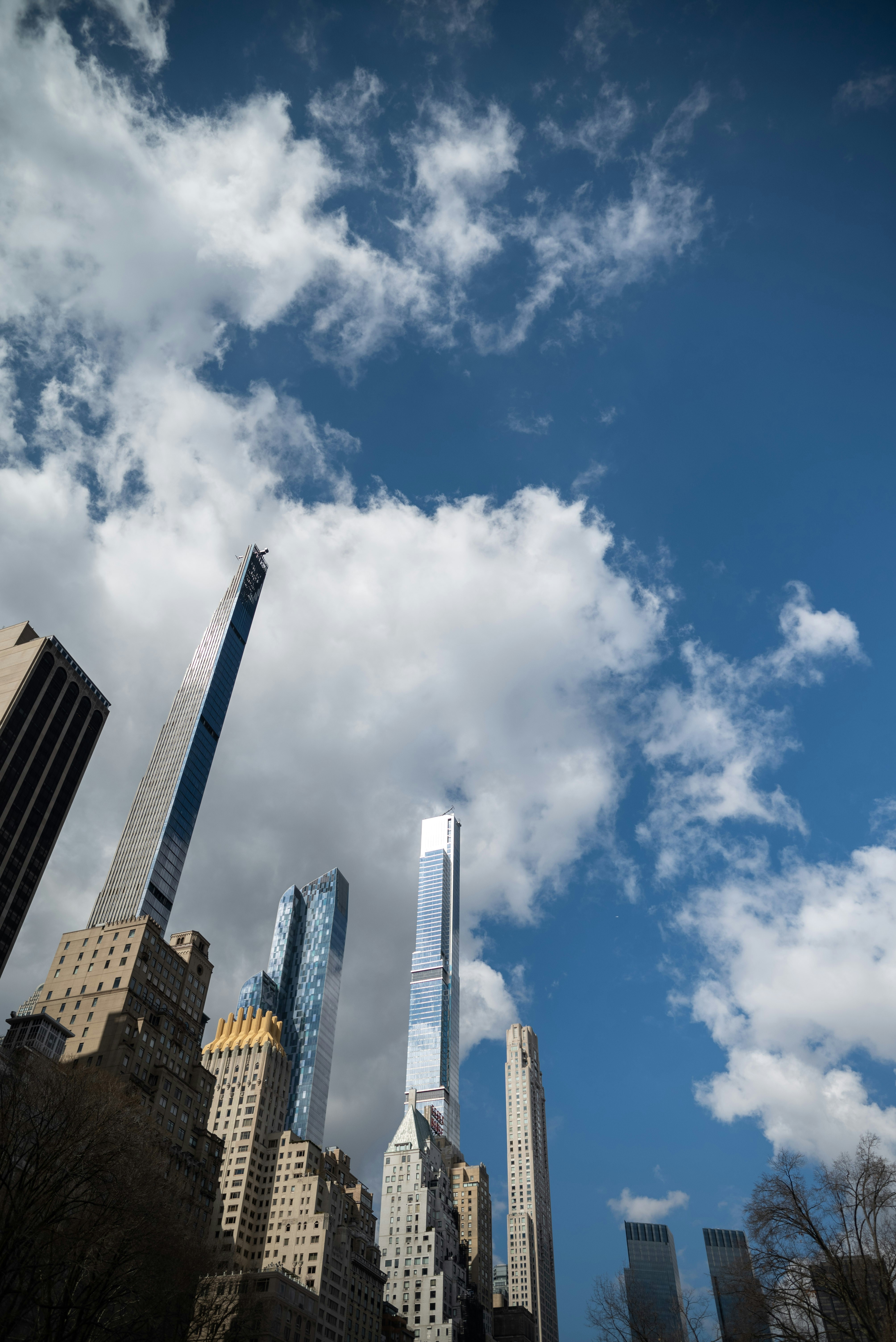 A very tall building towering over a city photo – Free Usa Image on ...