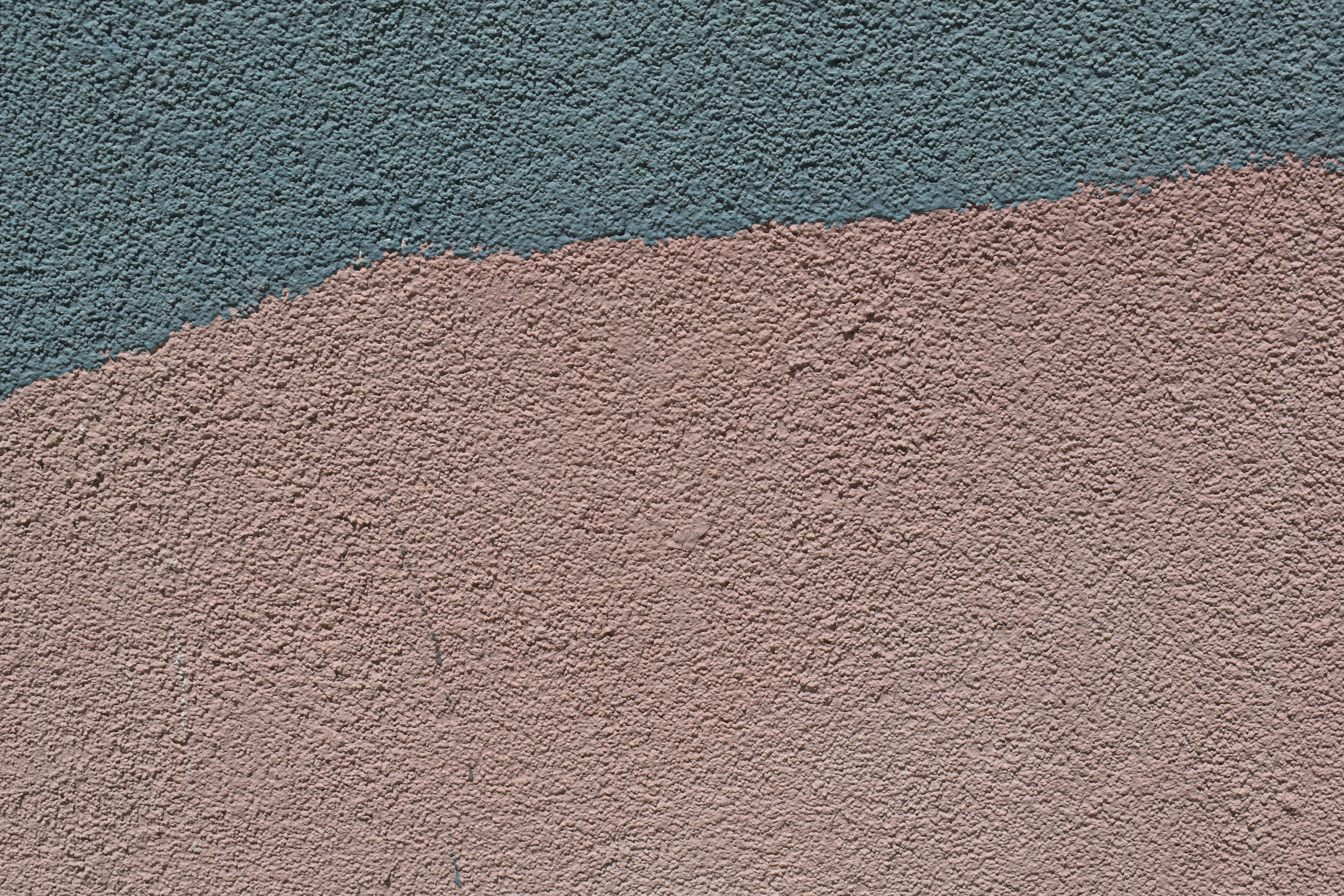 Two-Tone Wall: A Textured Boundary of Pink and Blue-Gray