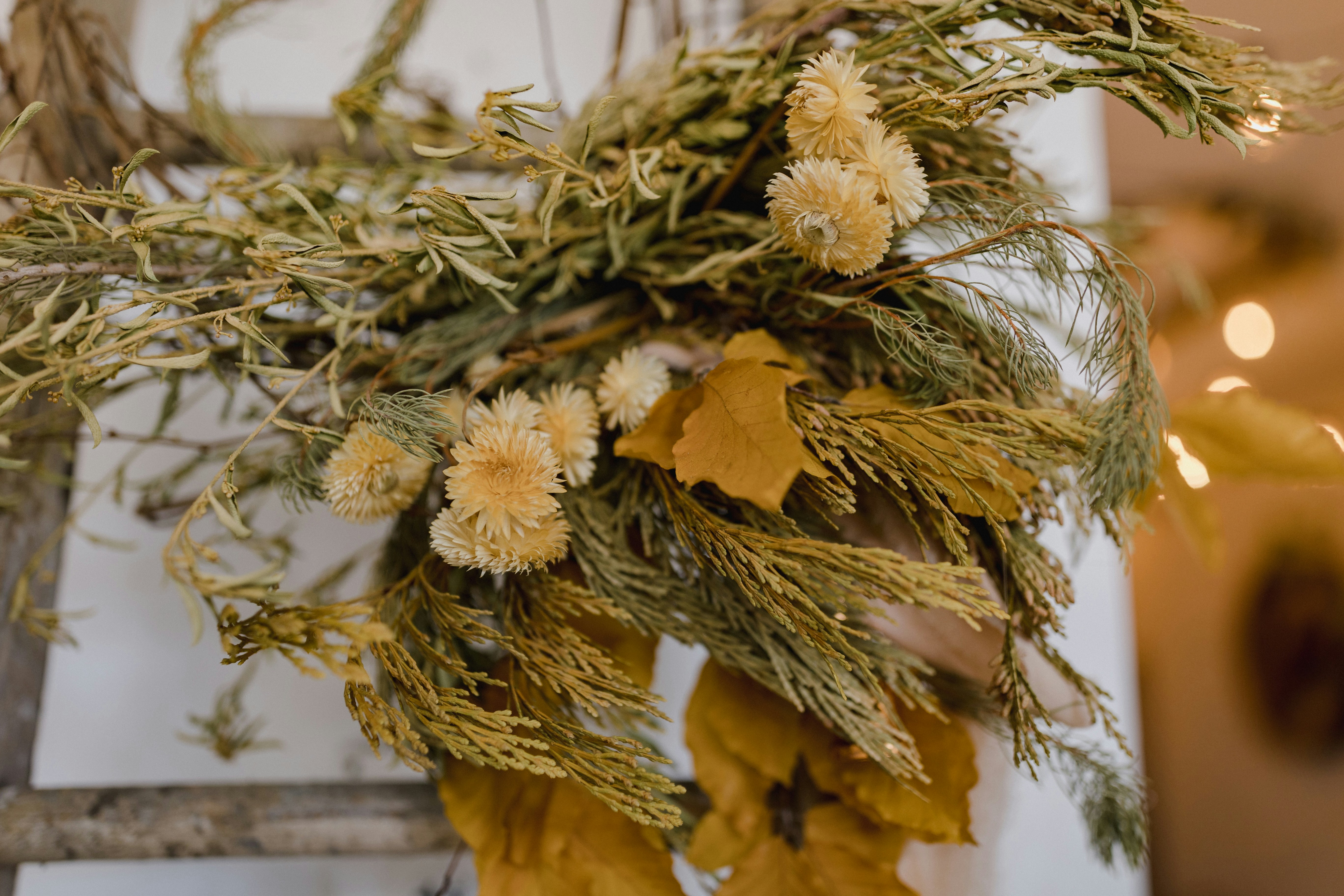 A bunch of dried flowers hanging from a ladder photo – Free Image on ...