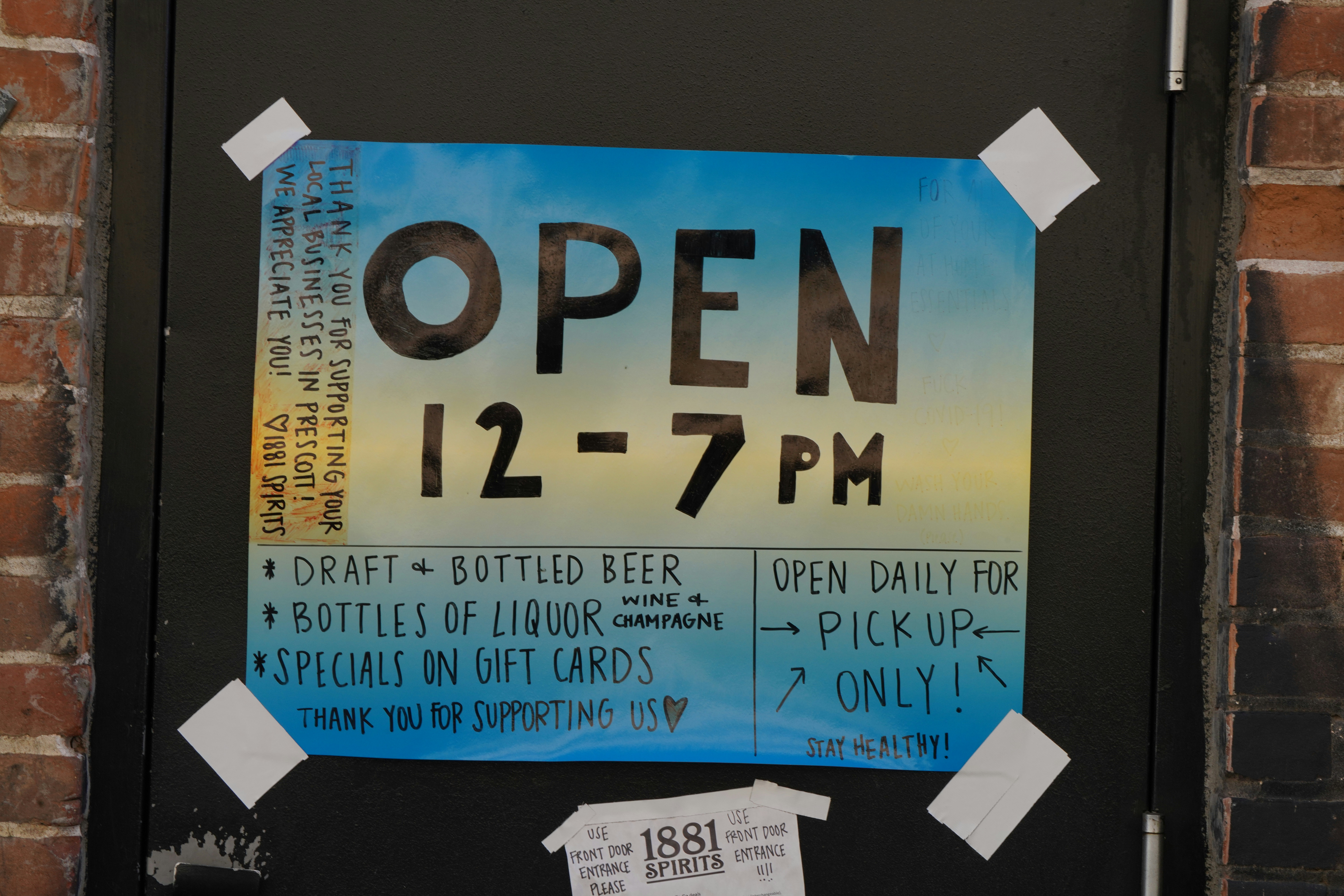 A sign on a door that says open 12 - 7pm photo – Free Sign Image on ...