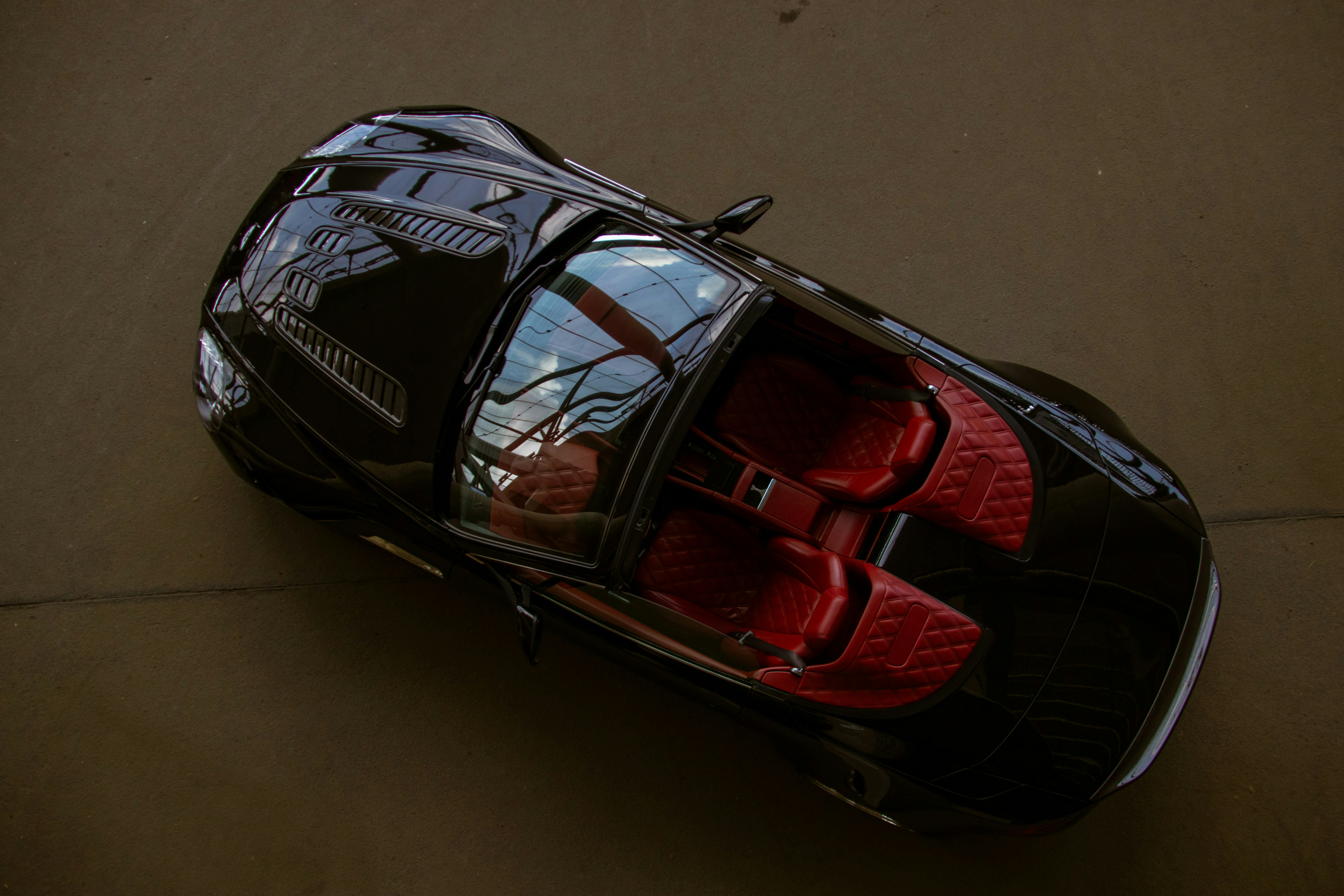 An overhead view of a black car with red seats photo – Free Poland ...