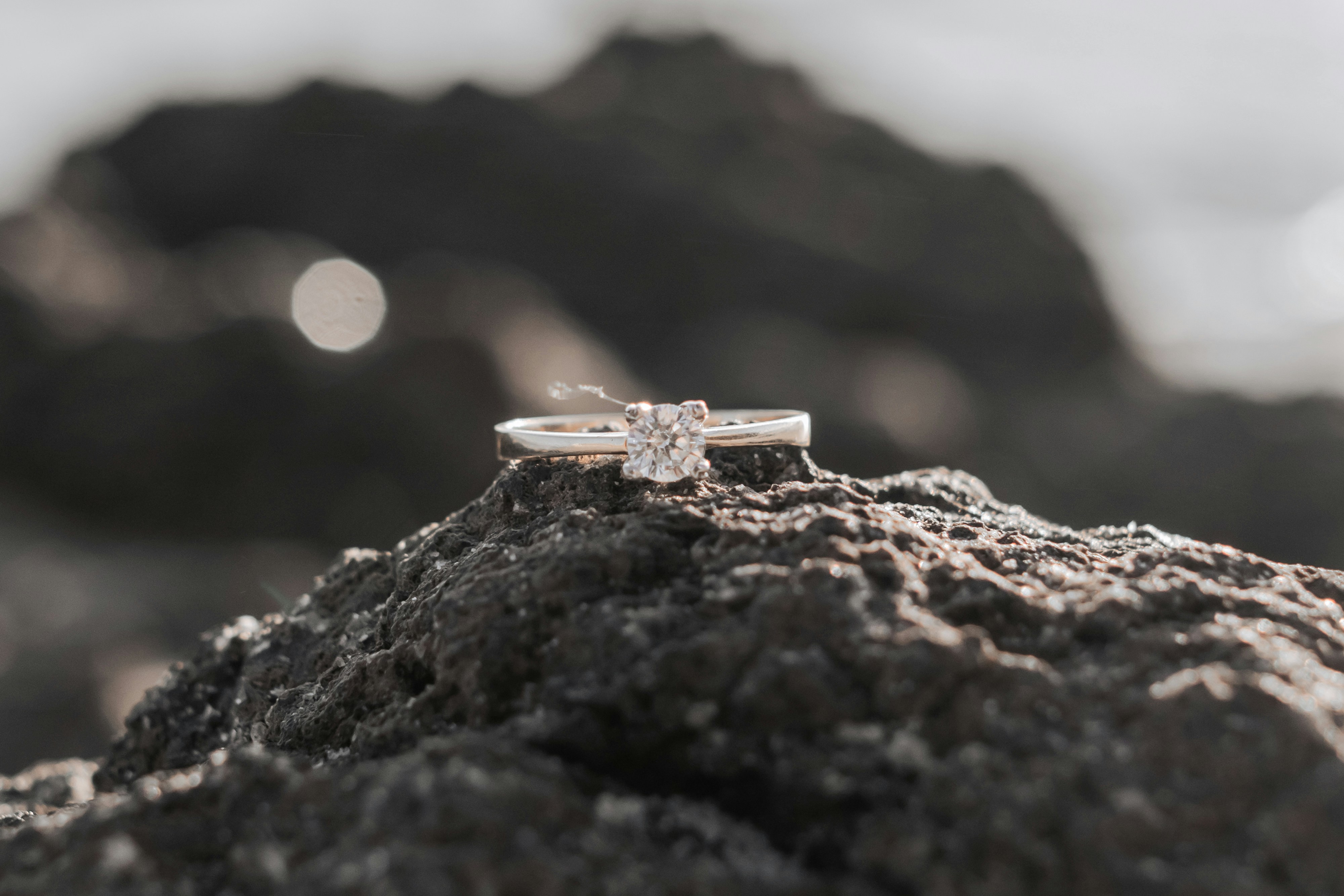 A couple of rings sitting on top of a rock photo – Free Accessories ...